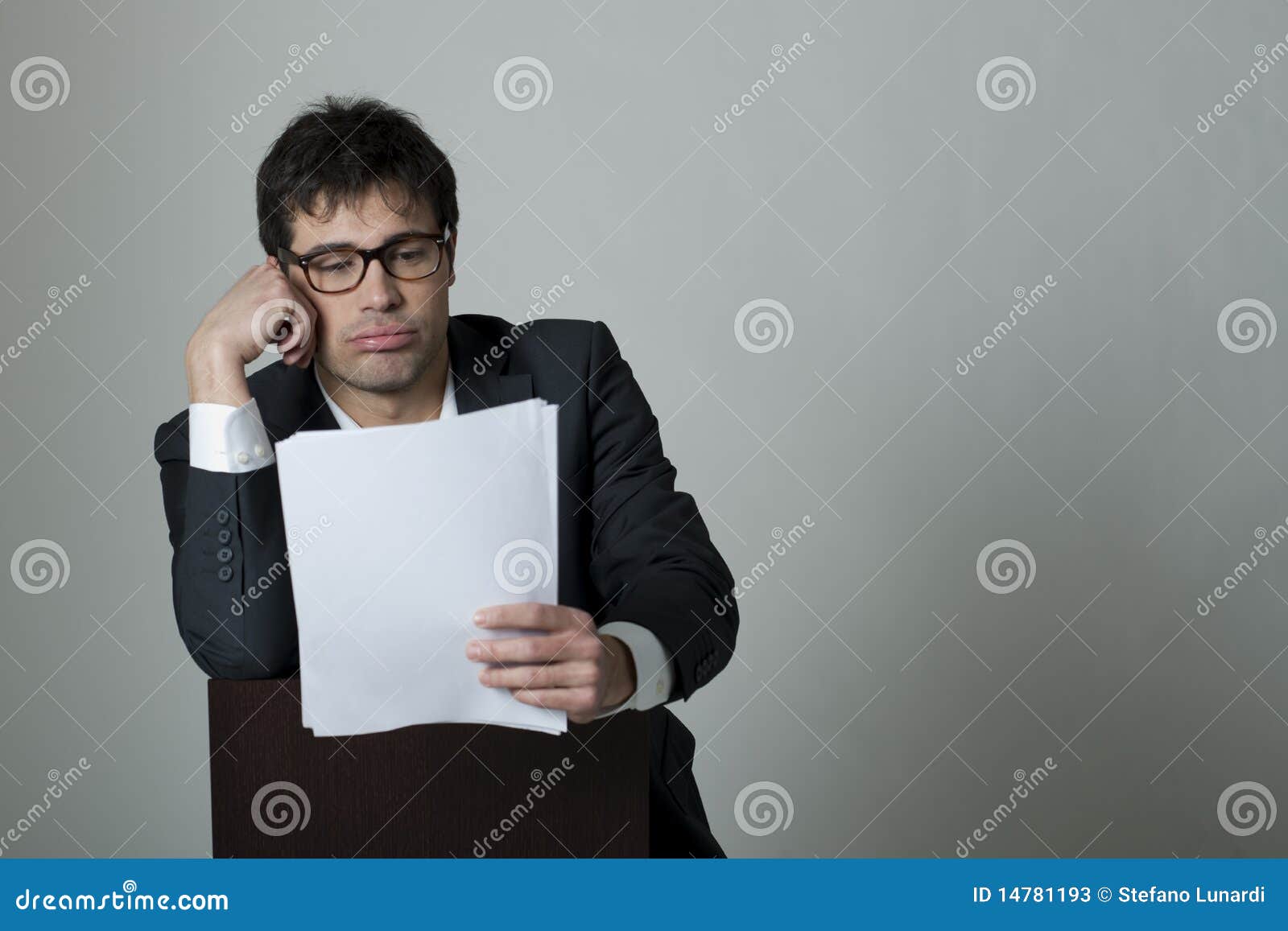 Businessman Reading Document Stock Image - Image of concentrated, bored ... Businessman Reading Document Stock Image - Image of concentrated, bored ...