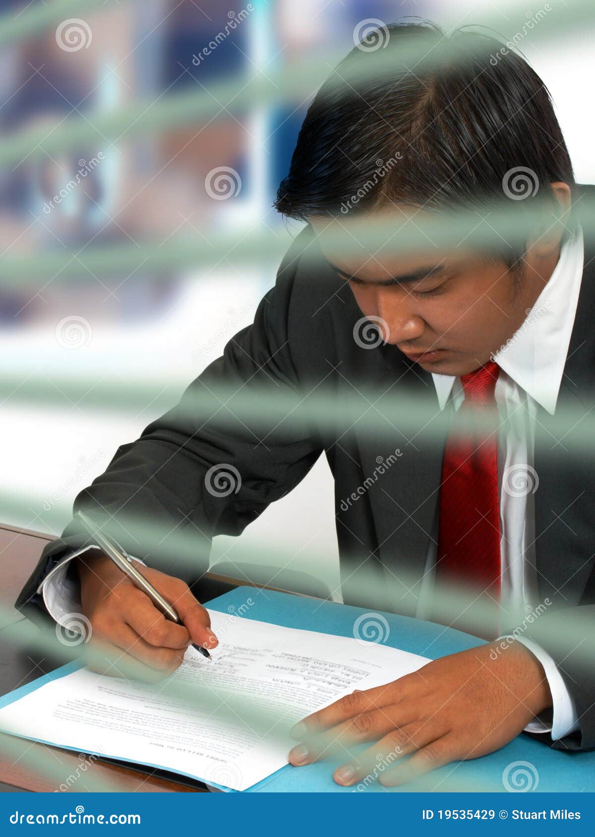 Businessman Reading a Document Stock Image - Image of sitting ...