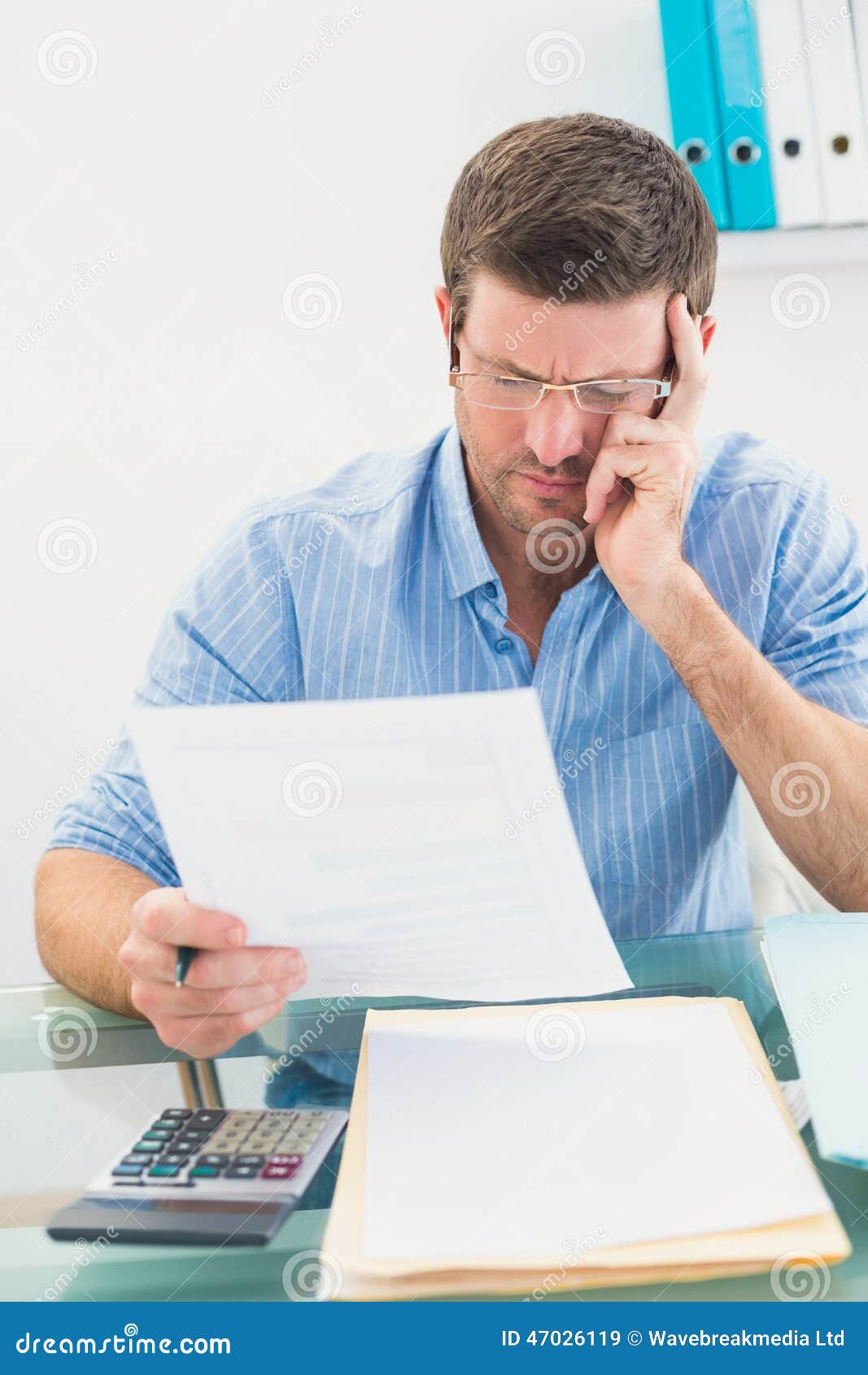 Businessman Reading Document at His Desk in His Office Stock Image ...
