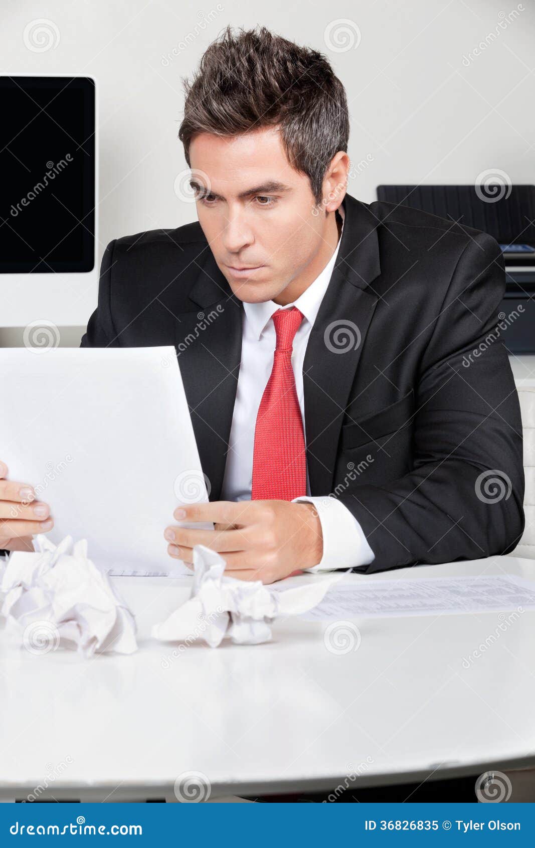 Businessman Reading Document in Office Stock Image - Image of holding ...