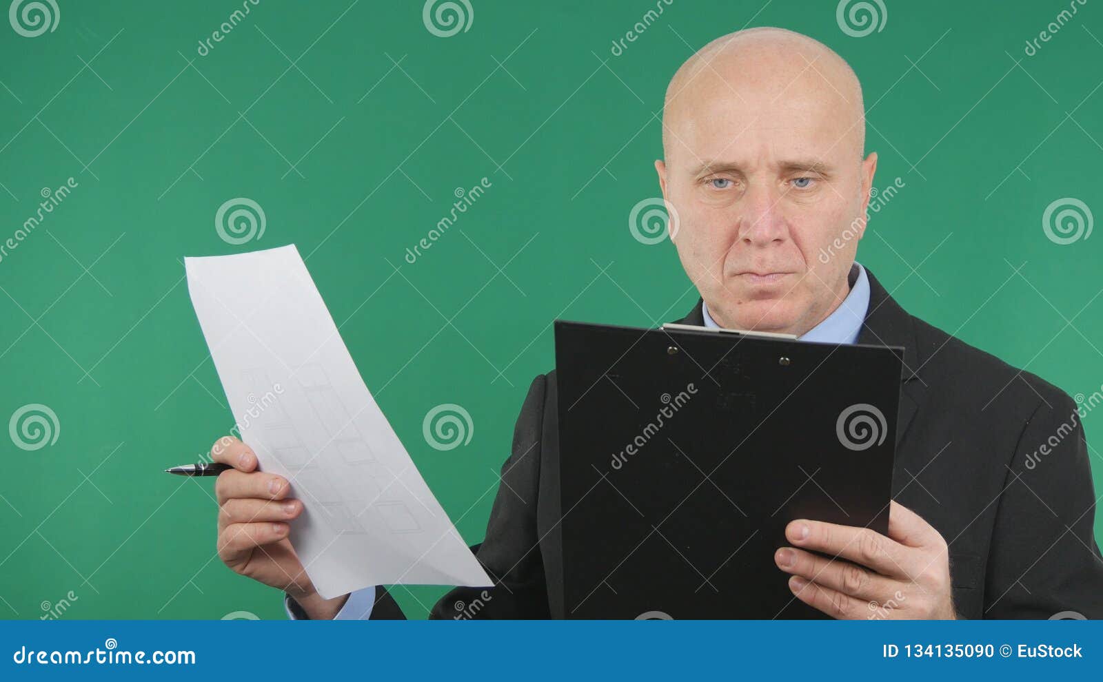 Businessman Reading Documents and Contracts with Green Screen in ...