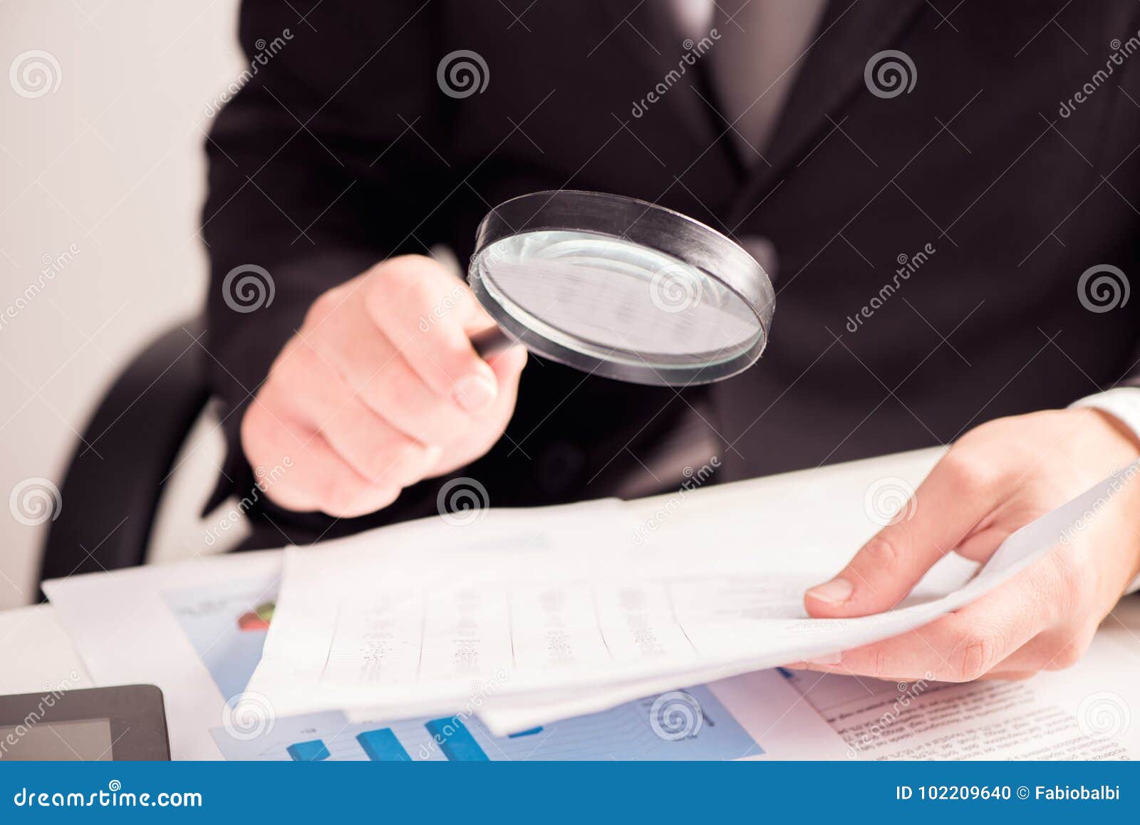 Businessman Reading Documents with Magnifying Glass Stock Photo - Image ...
