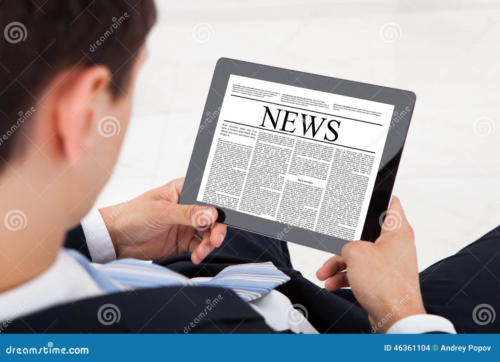 Businessman Reading News on Digital Tablet in Office Stock Photo ...
