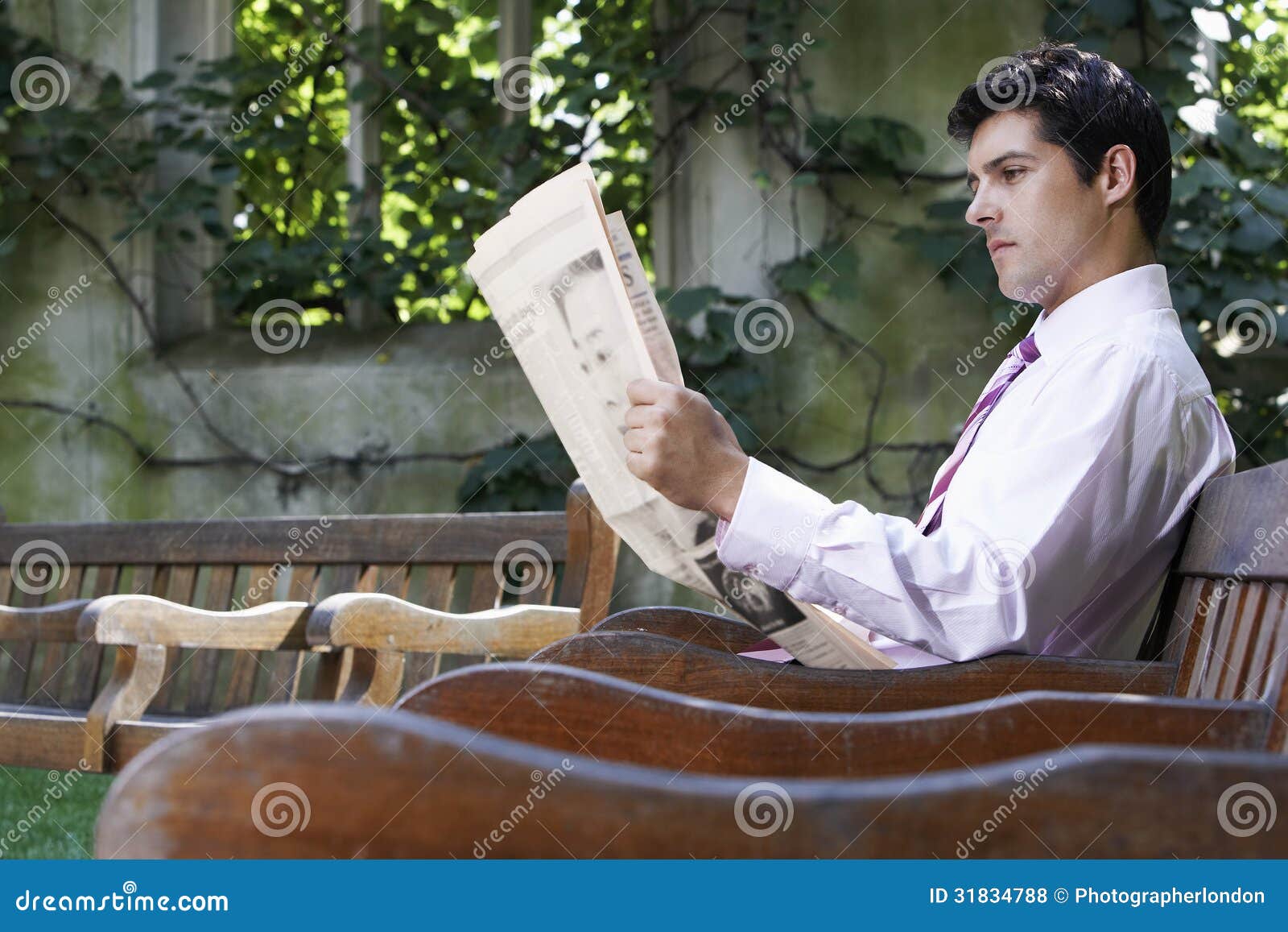 Businessman Reading Newspaper on Park Bench Stock Photo - Image of ...