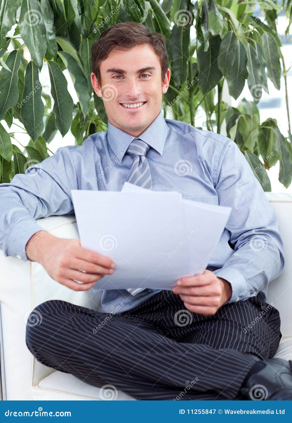Businessman Reading Papers and Smiling Stock Image - Image of happy ...