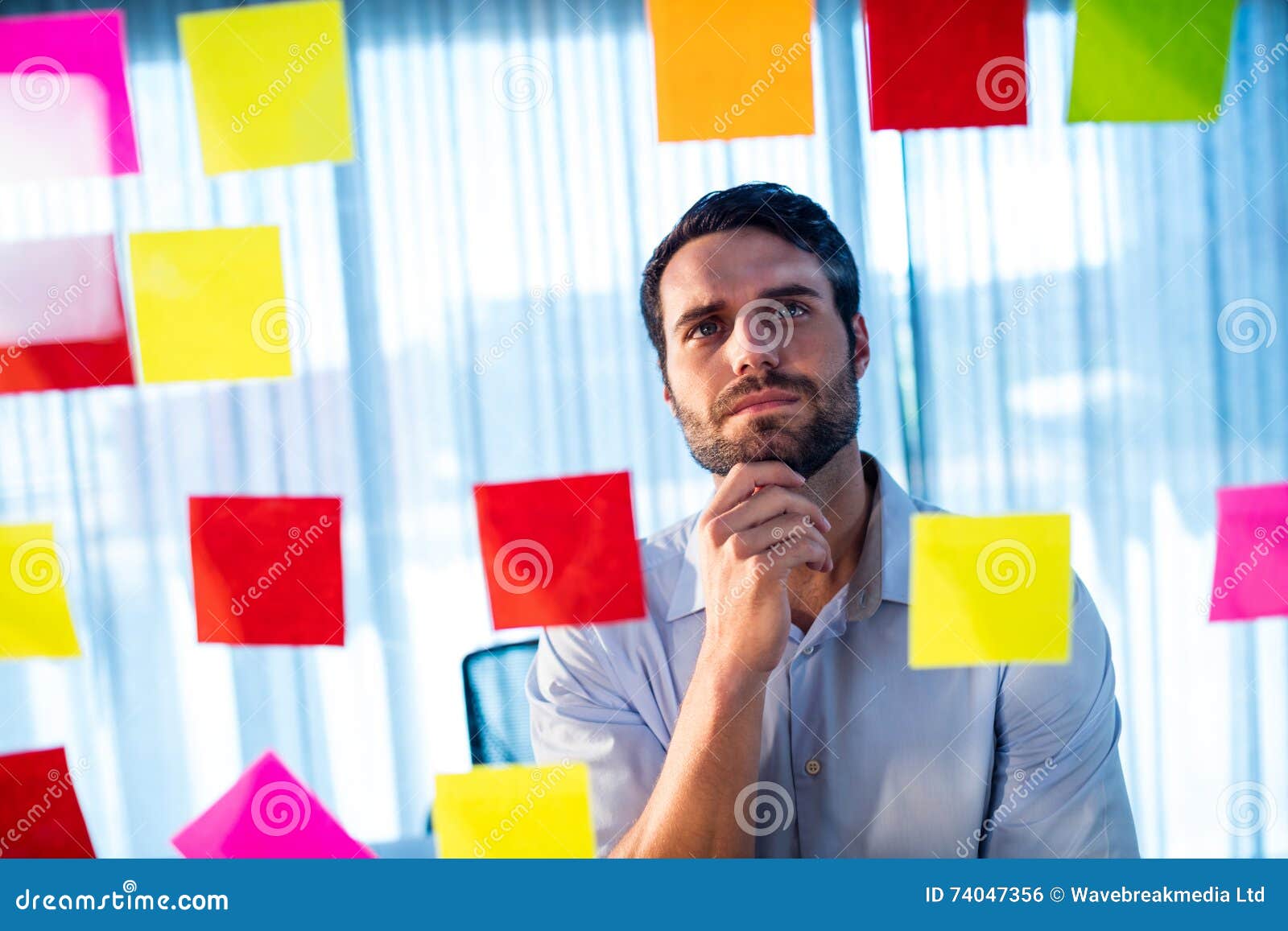 Businessman Reading Post it Stock Photo - Image of male, thoughtful ...