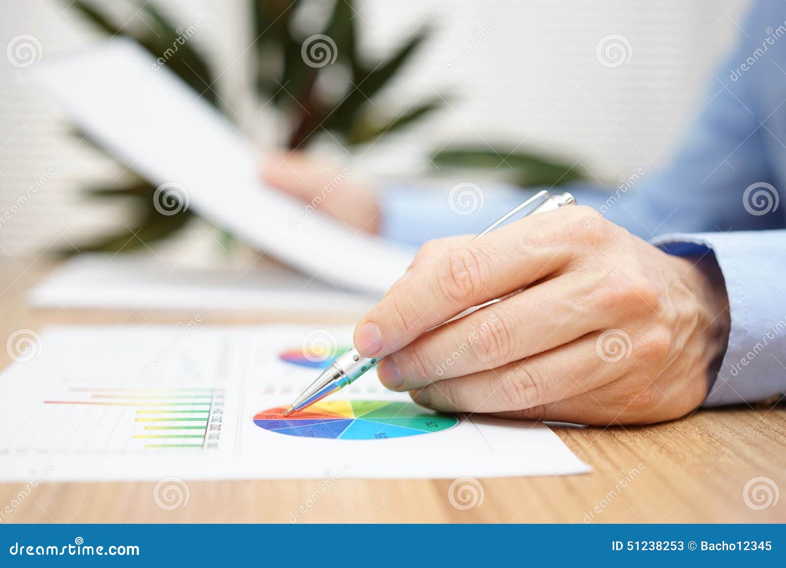 Businessman is Reading Report and Checking Data on Graph Stock Image ...
