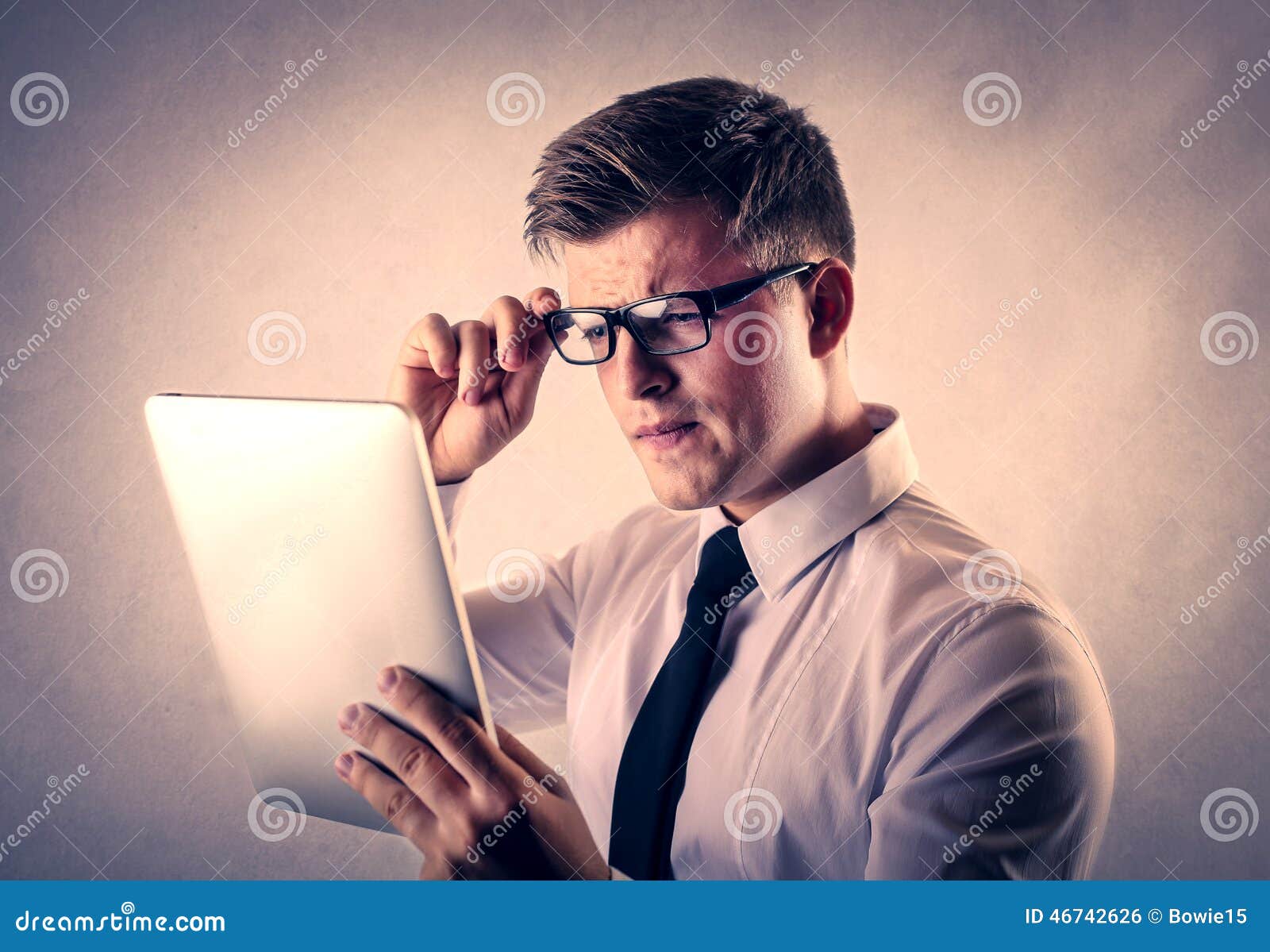 Businessman Reading a Report on a Tablet Stock Photo - Image of modern ...