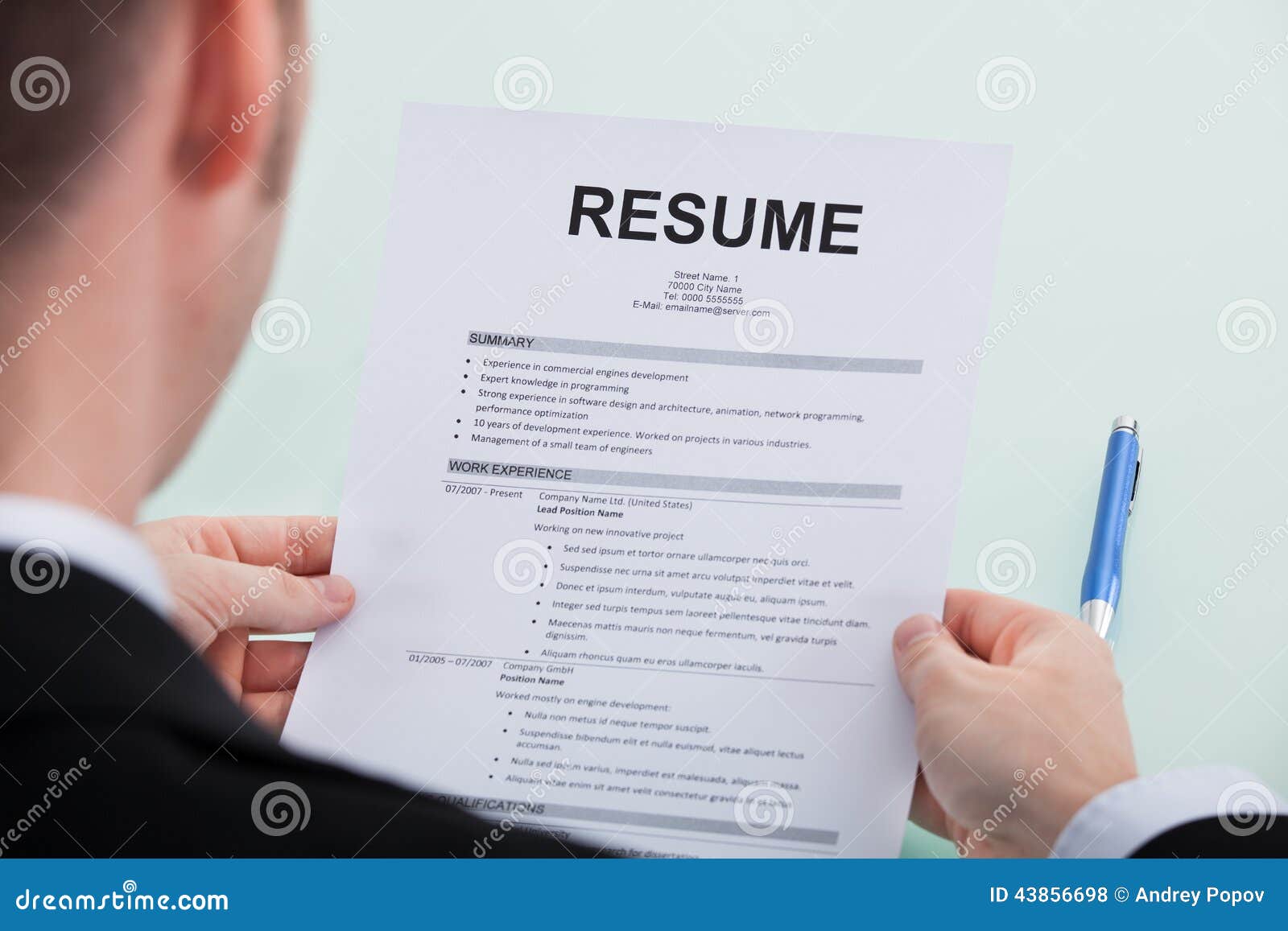 Businessman Reading Resume at Office Desk Stock Photo - Image of ...