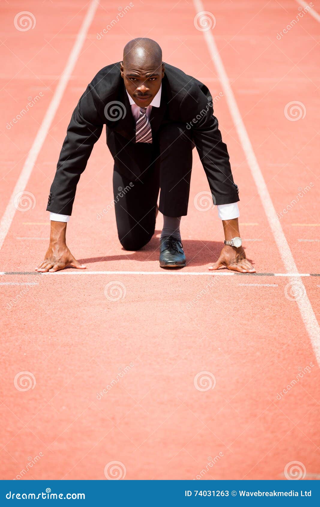 Businessman ready to run stock image. Image of outdoors - 74031263