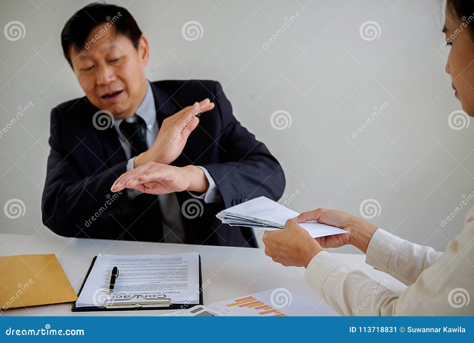 Businessman Refusing Money in the Envelope To Agreement Contract Stock ...