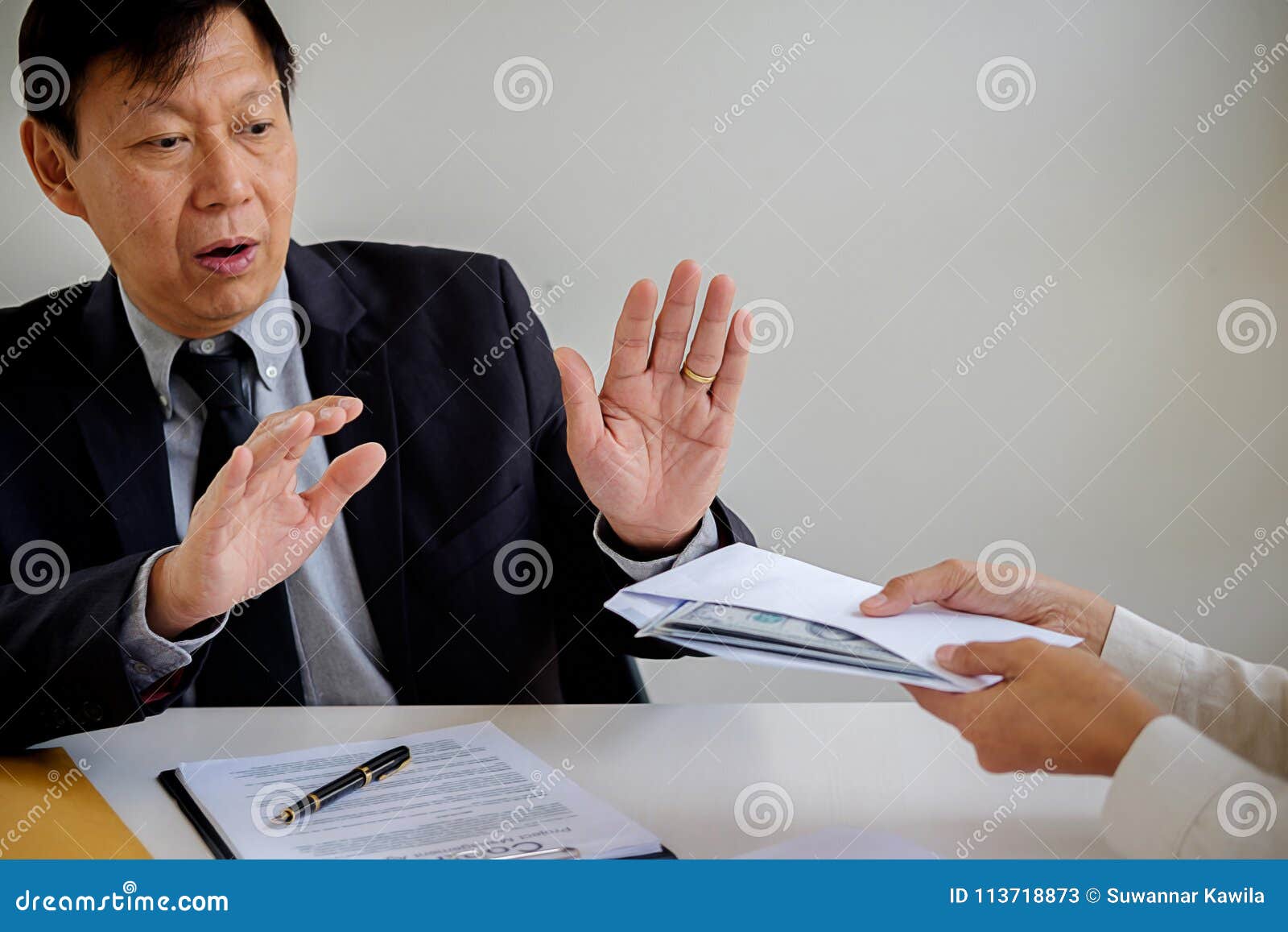 Businessman Refusing Money in the Envelope To Agreement Contract Stock ...
