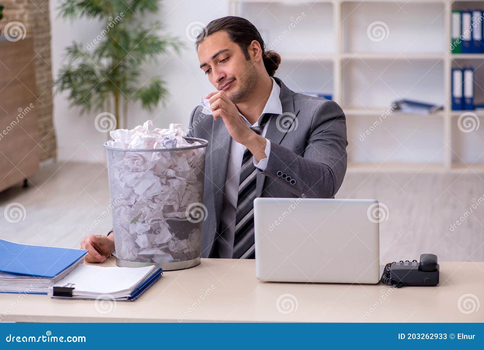 Young Businessman Rejecting New Ideas with Lots of Papers Stock Image ...