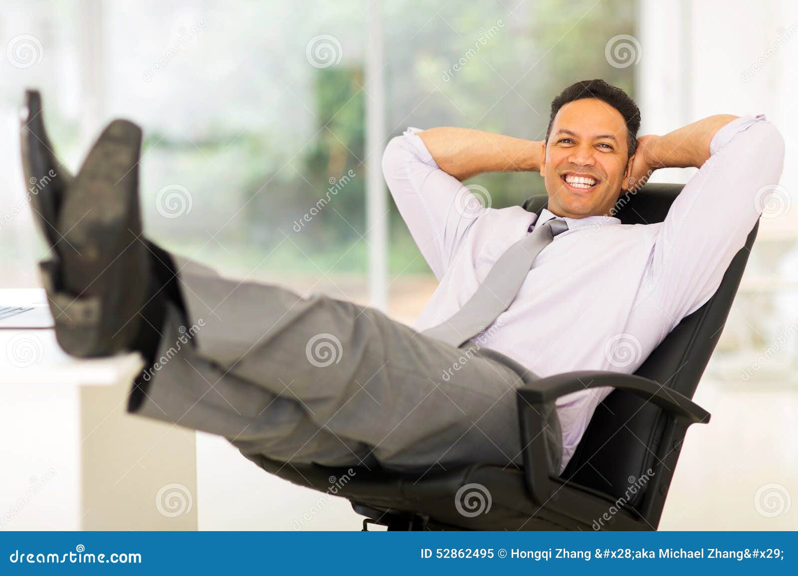 Businessman Relaxing in Office Stock Image - Image of male, businessman ...