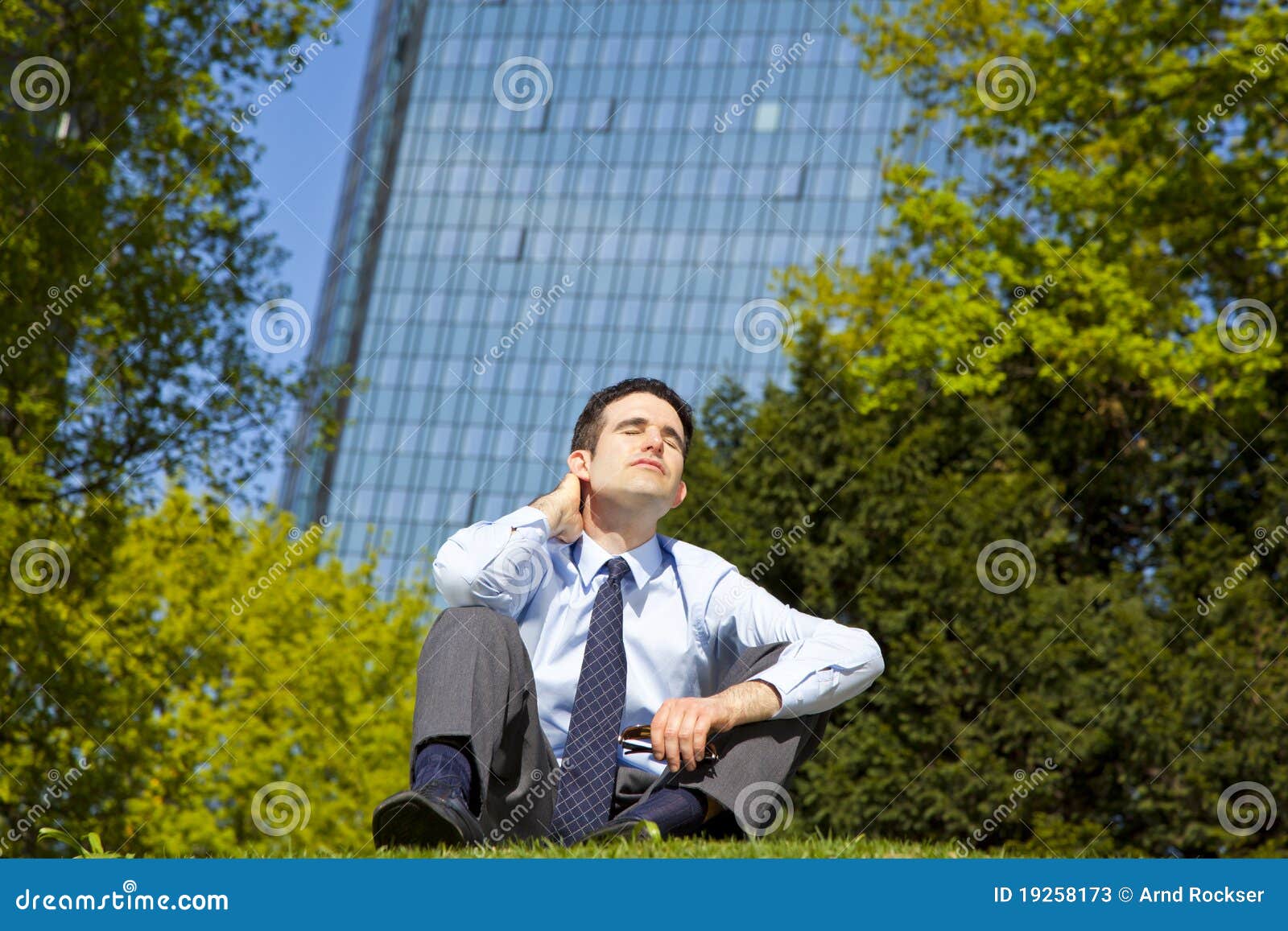 Businessman Relaxing in Park during Lunch Break Stock Image - Image of ...