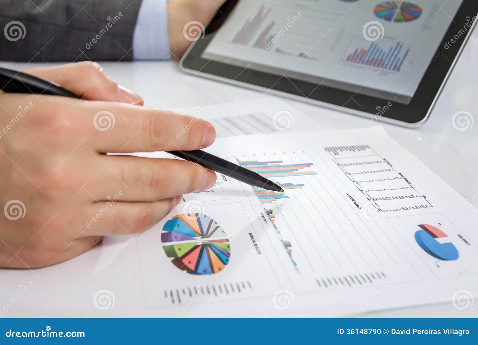 Businessman Reviewing Documents in Digital Tablet Stock Photo - Image ...