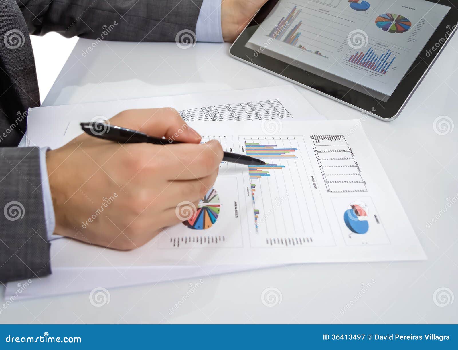 Businessman Reviewing Documents in Digital Tablet Stock Image - Image ...