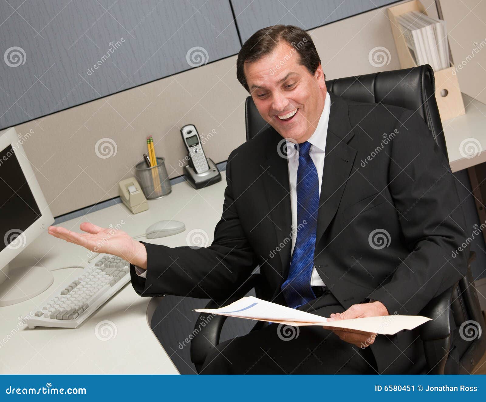 Businessman Reviewing File Folder at Desk Stock Image - Image of ...