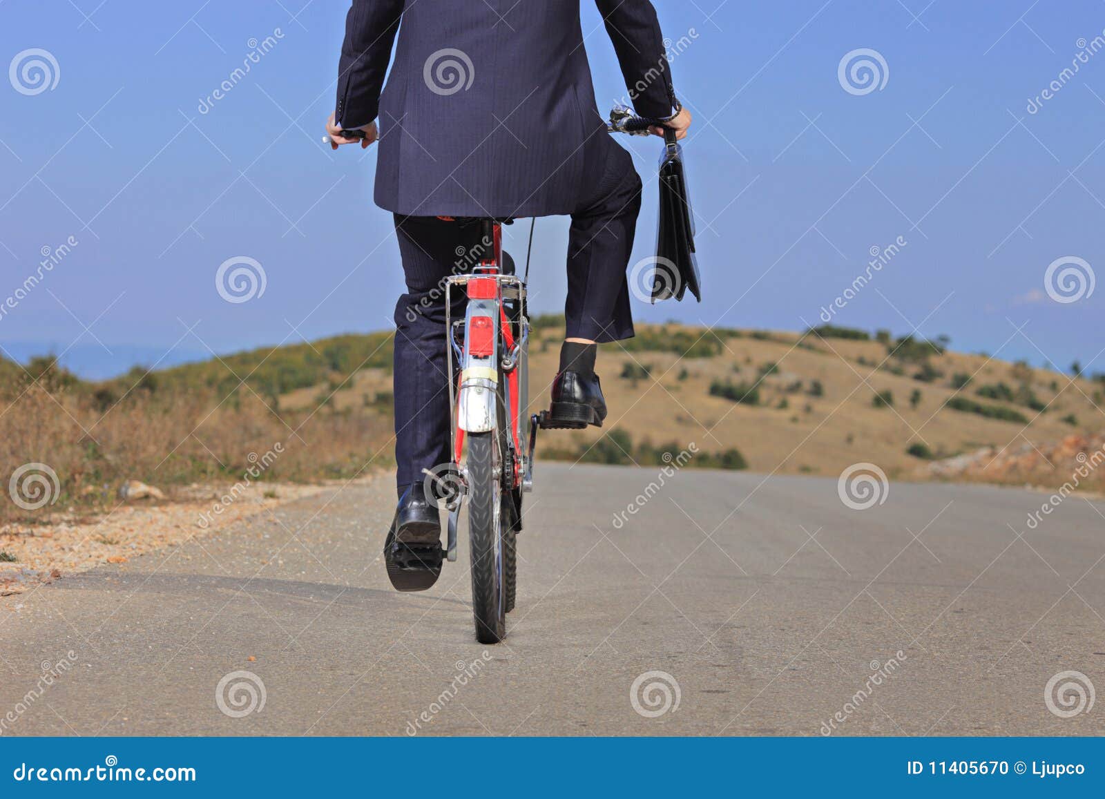 Businessman riding a bike stock photo. Image of office - 11405670