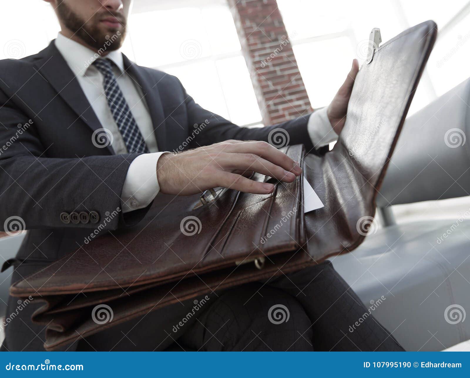 Businessman`s Hand with Suitecase in a Modern Office Stock Photo ...