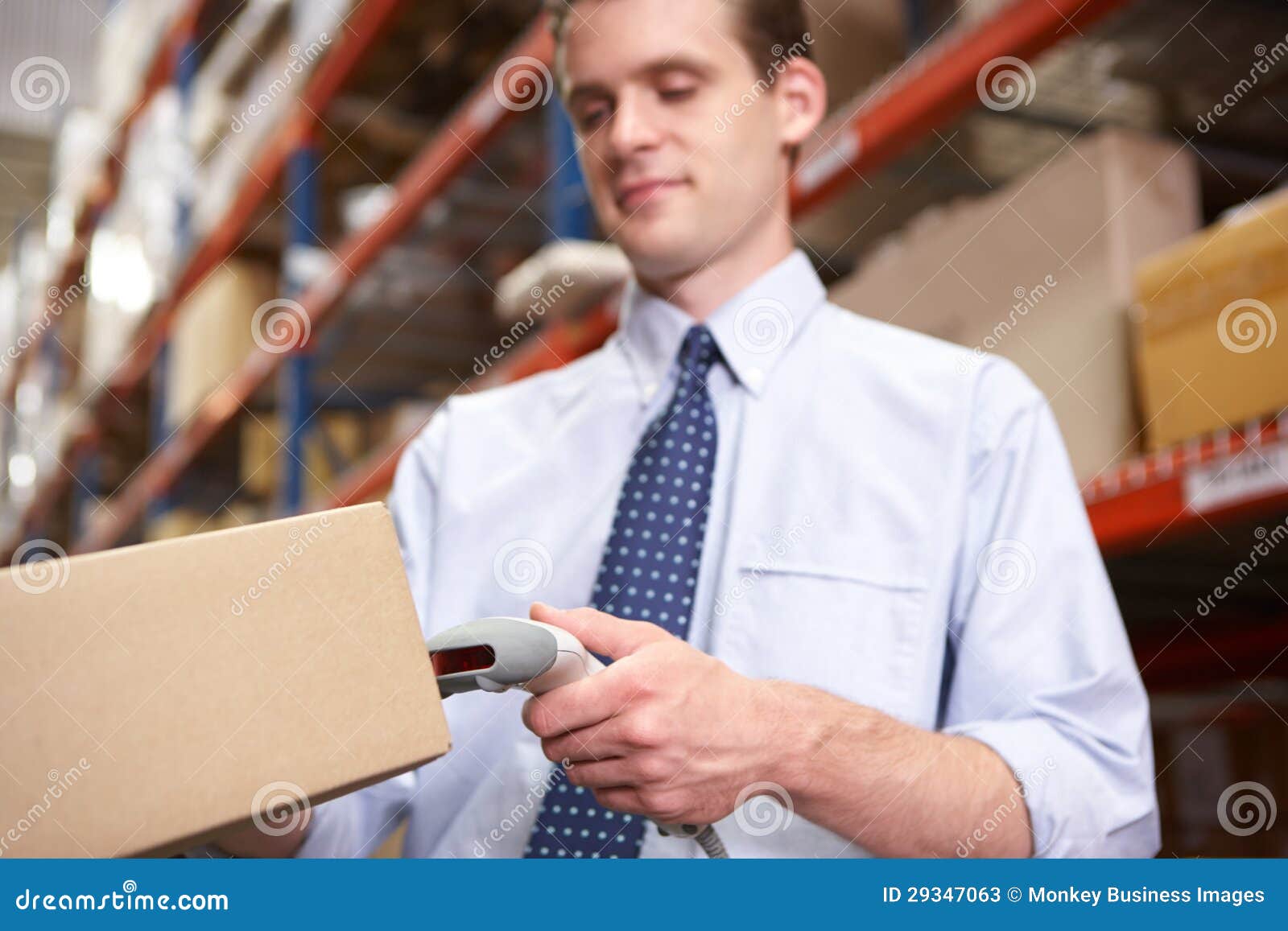Businessman Scanning Package in Warehouse Stock Image - Image of ...