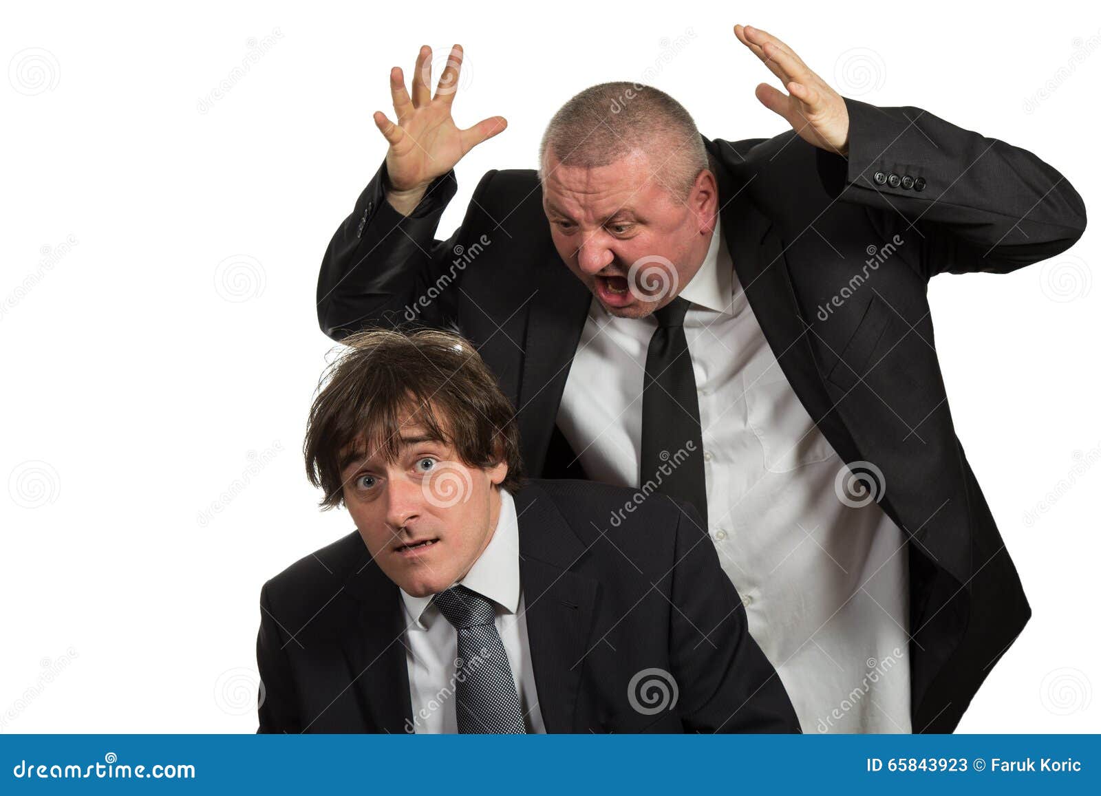 Businessman Screaming and Fighting at a Young Colleague Stock Image ...