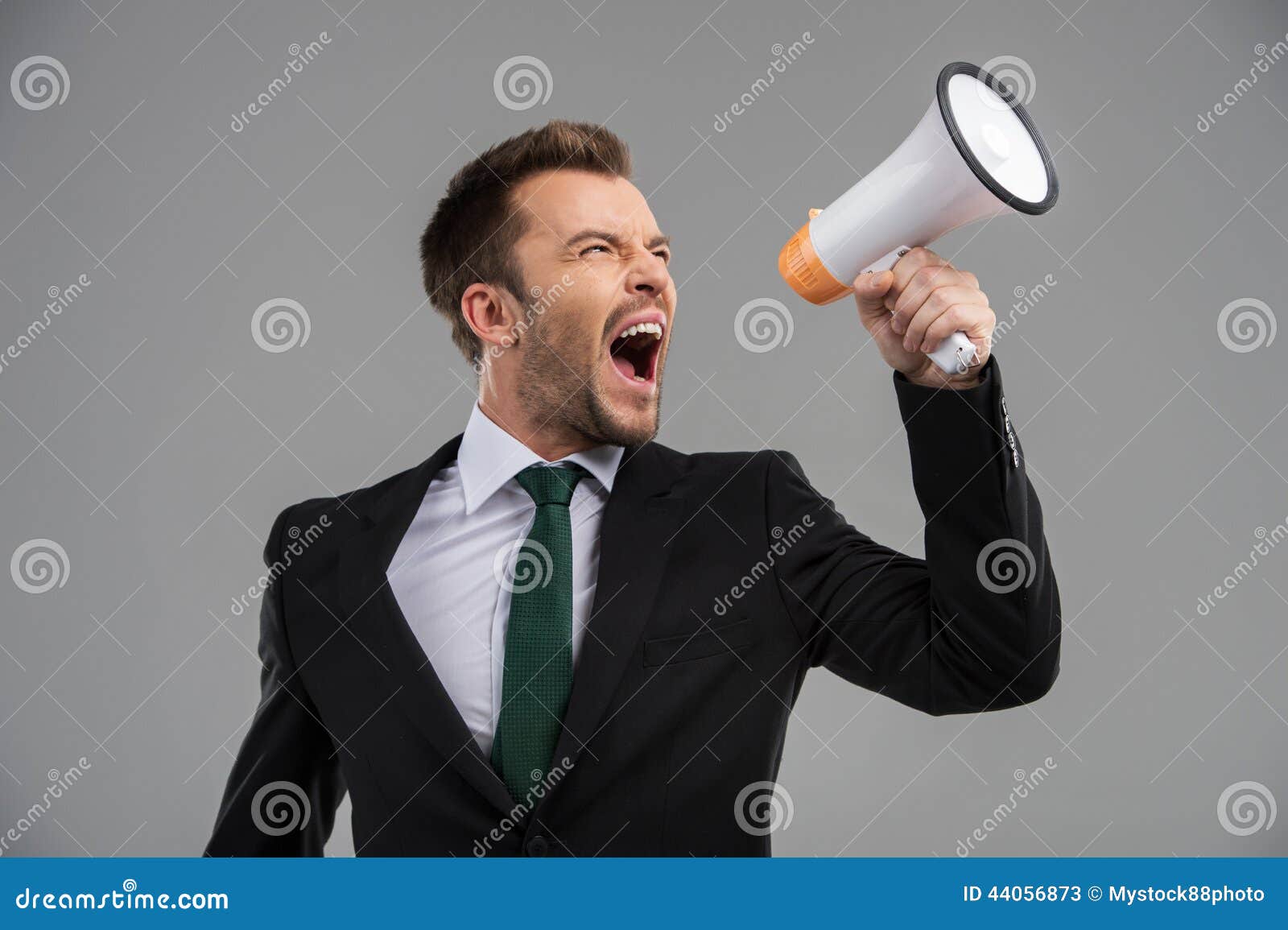 Businessman Screaming in Megaphone on Grey Background. Stock Image ...