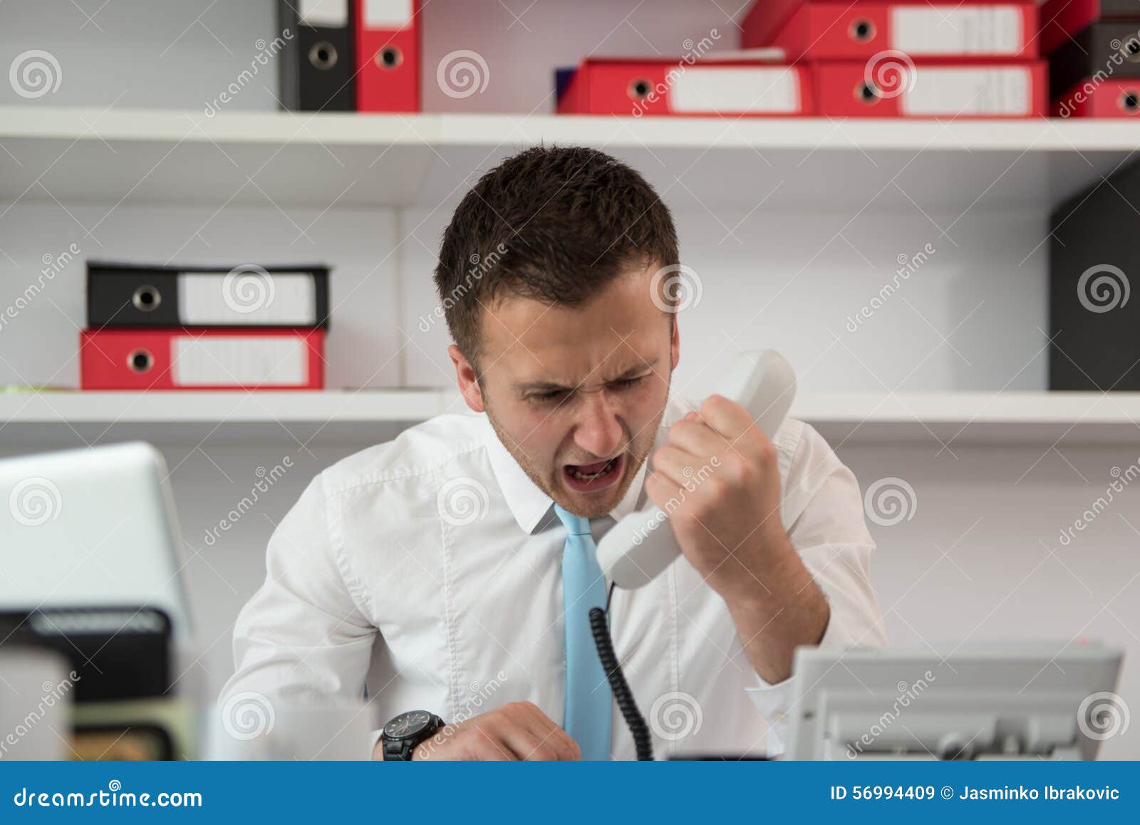 Businessman Screaming into a Phone Stock Image - Image of businessman ...