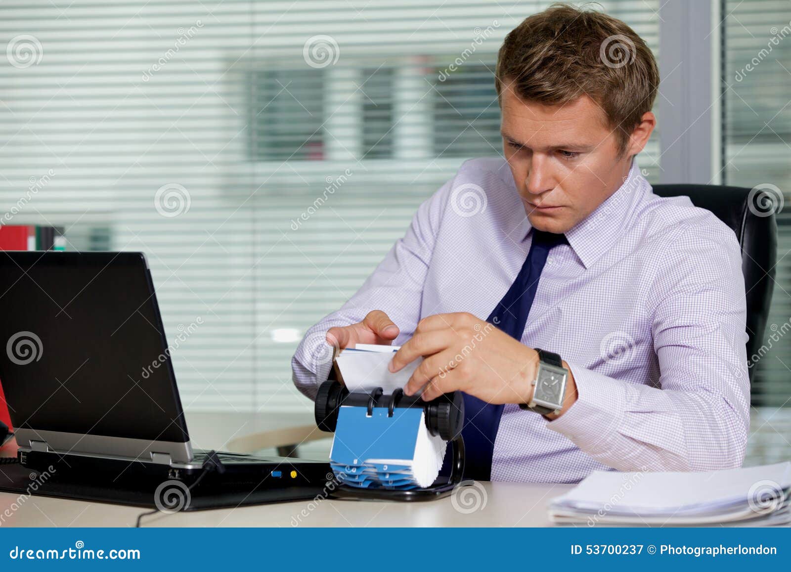 Businessman Searching for Card by Laptop in Office Stock Image - Image ...