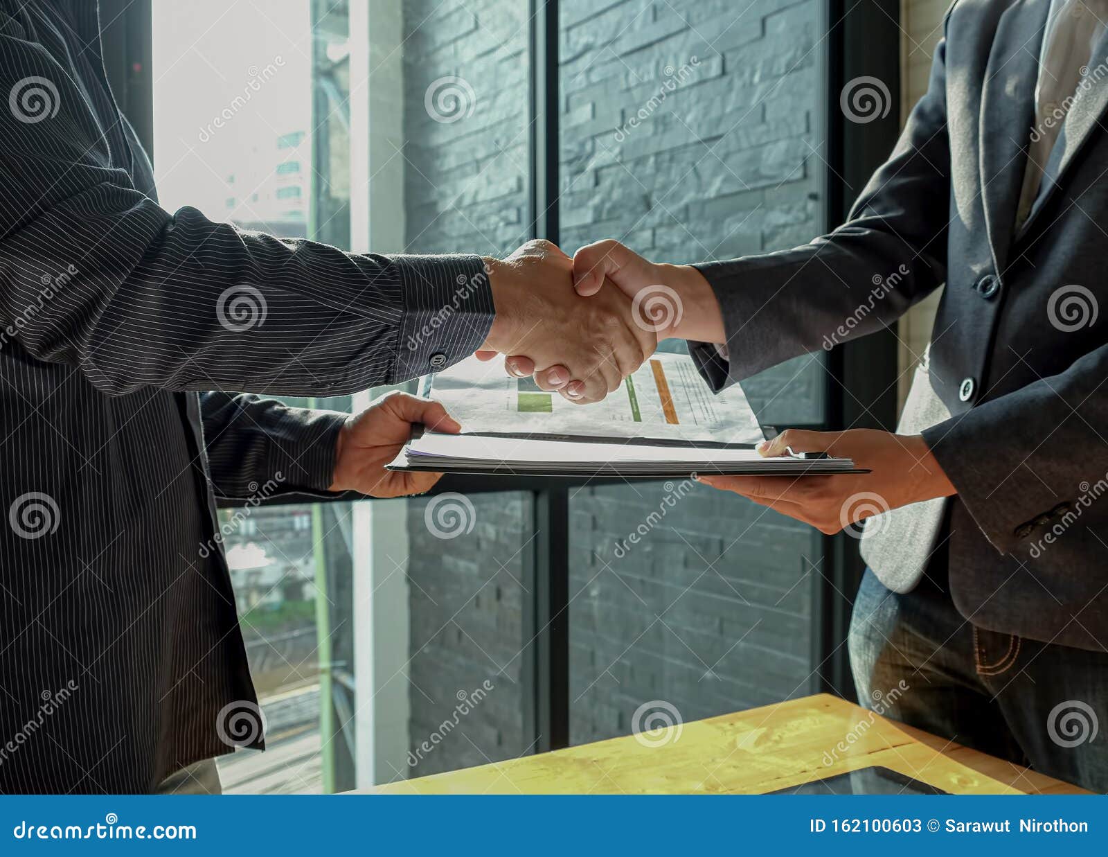 Businessman Shakehand and Exchanging Contract Documents Stock Image ...