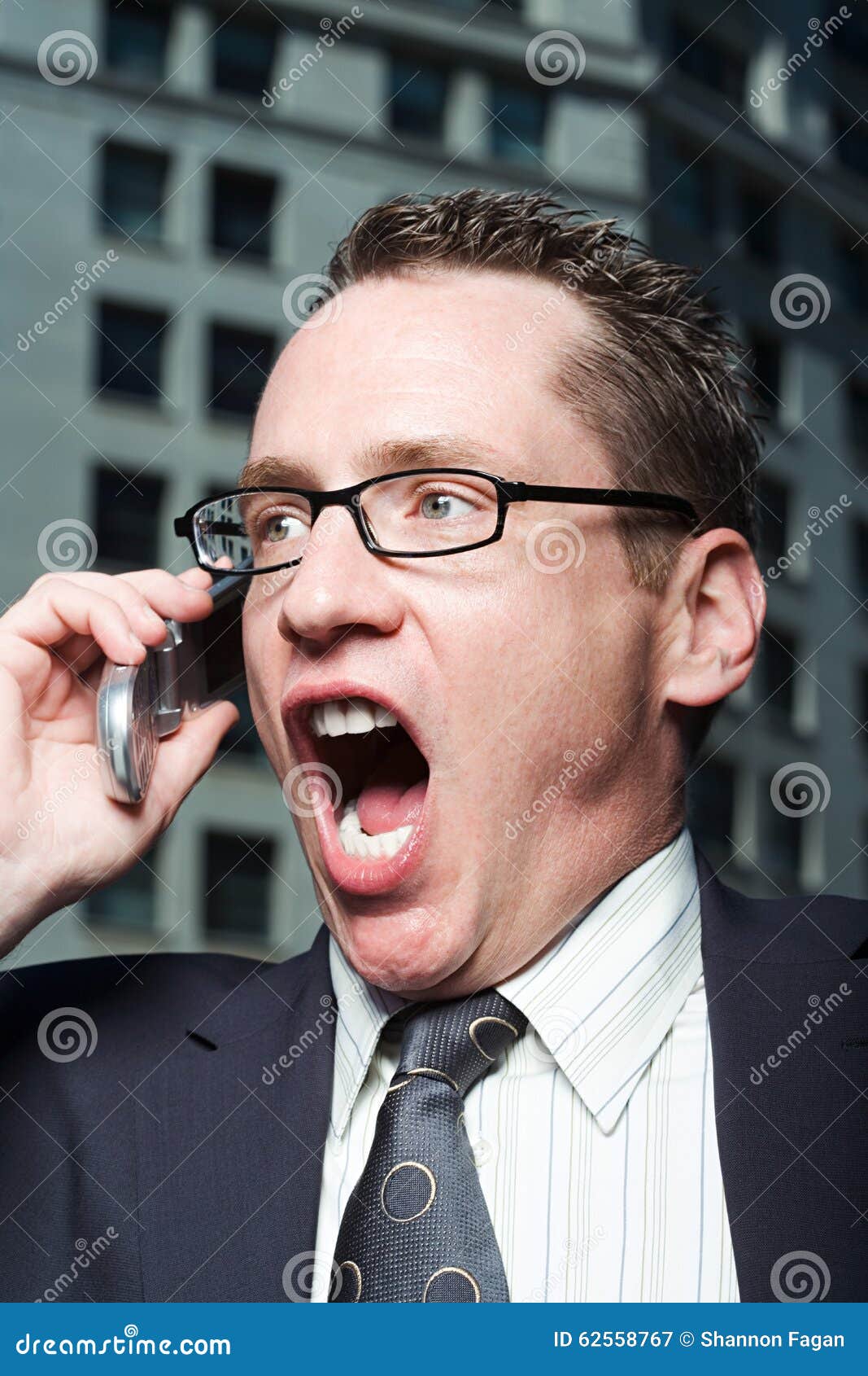 Businessman Shouting into Phone Stock Image - Image of anger, cellular ...