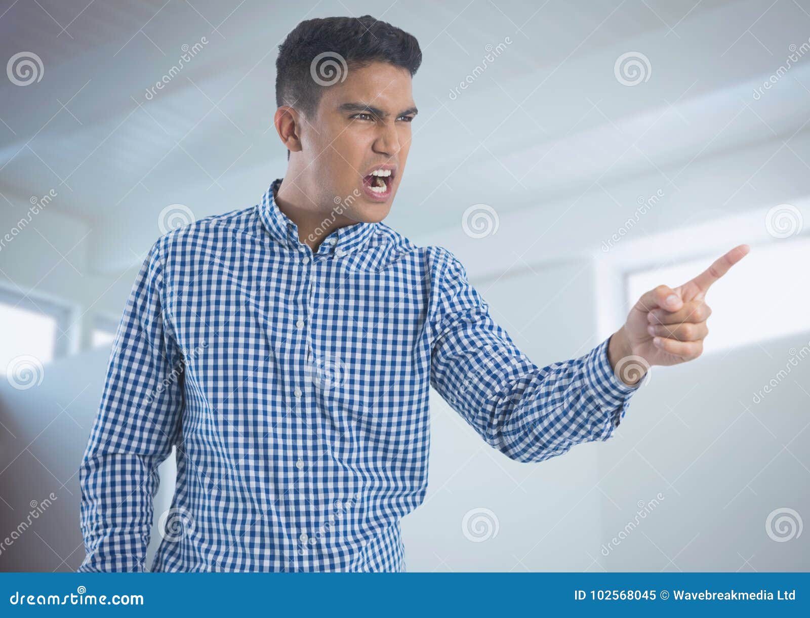 Businessman Shouting and Pointing Angrily in Minimal Room Stock Image ...