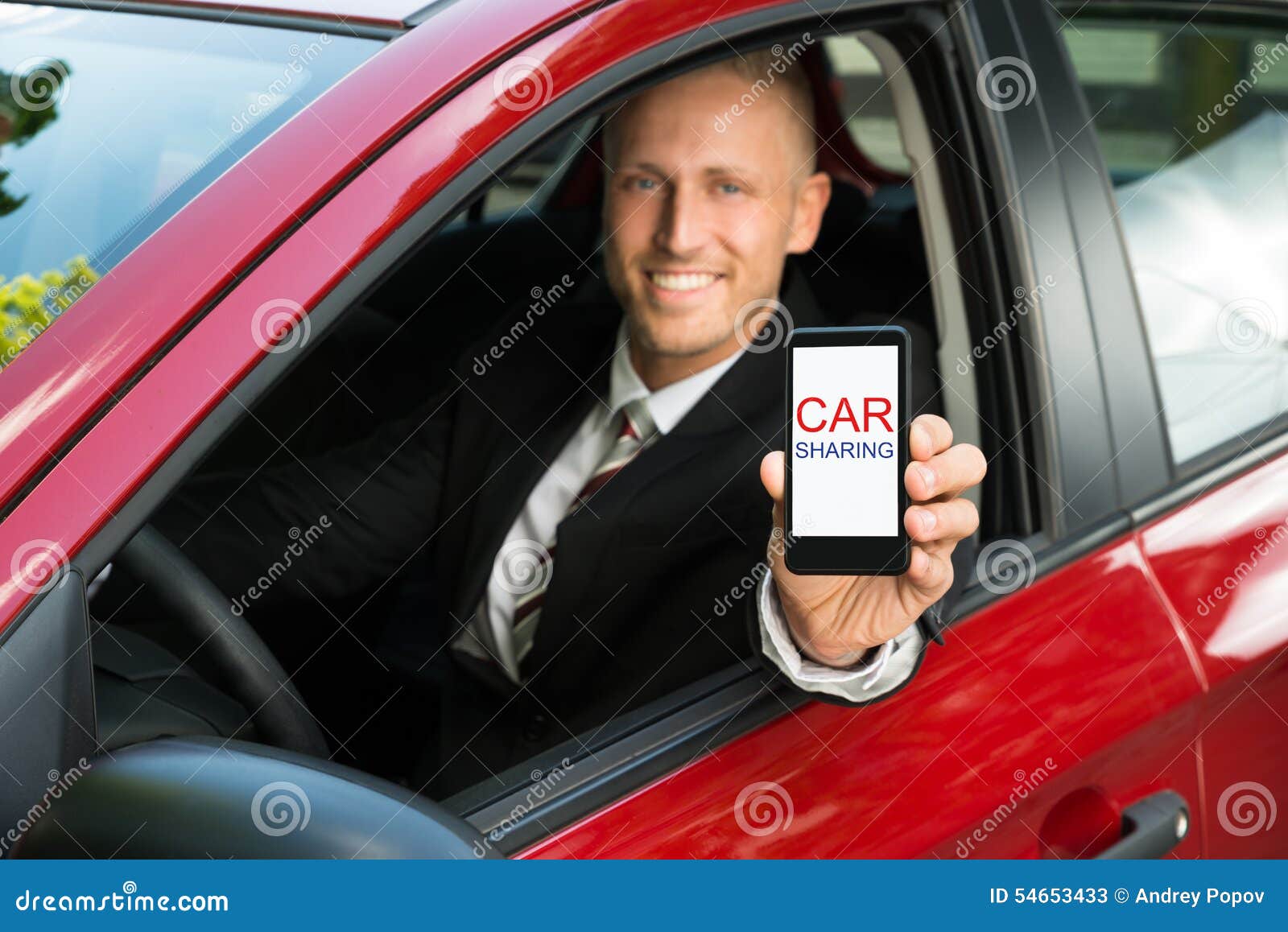 Businessman Showing Cellphone with Car Sharing Text on Screen Stock ...
