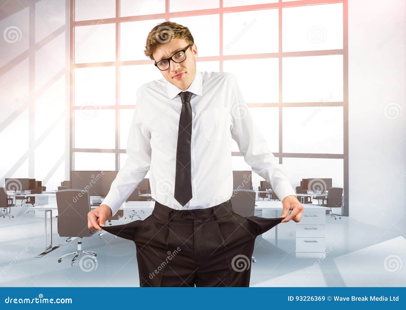 Businessman Showing Empty Pockets while Standing in Office Stock Image ...