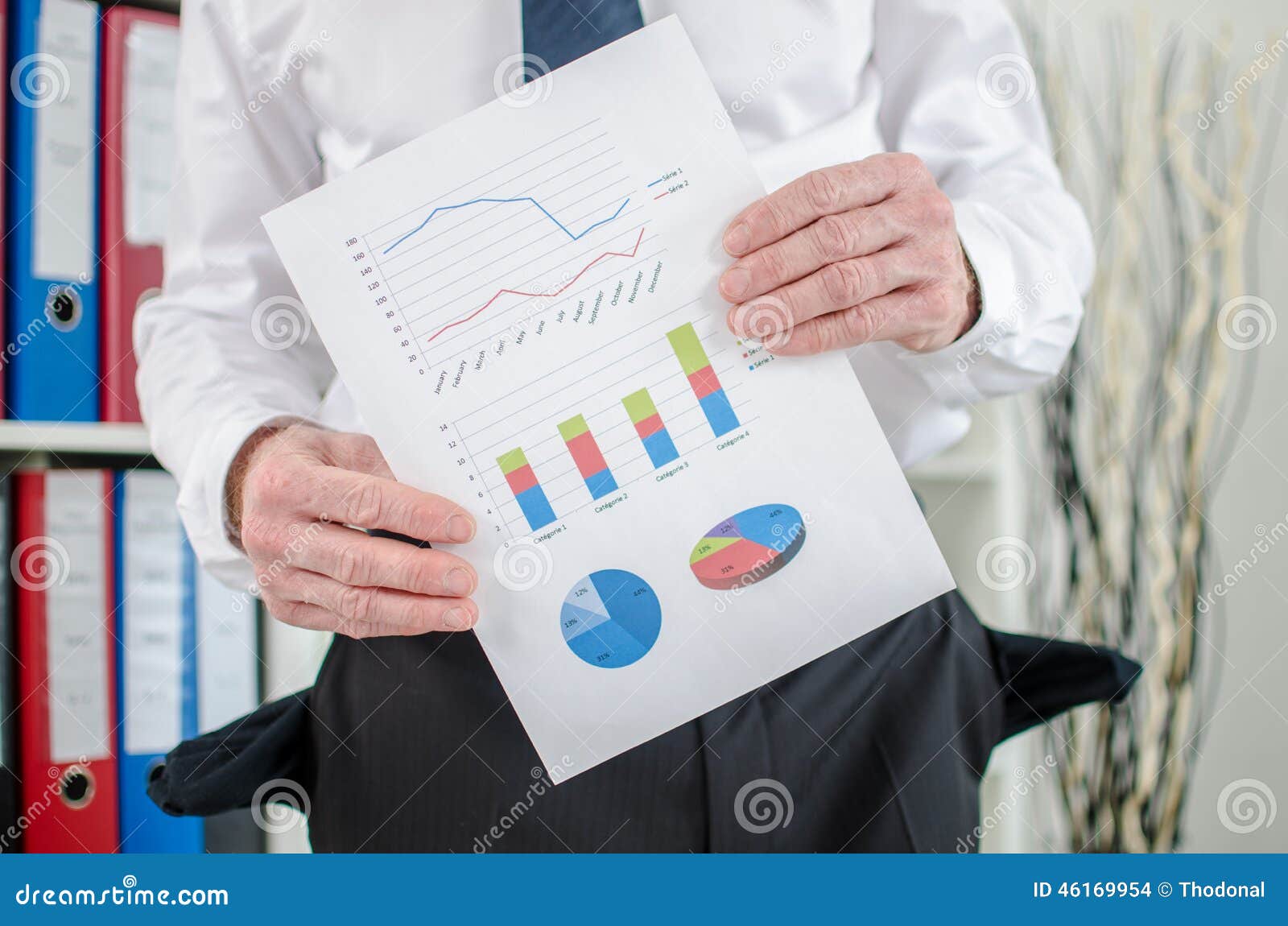 Businessman Showing Graphs with Poor Results Stock Photo - Image of ...