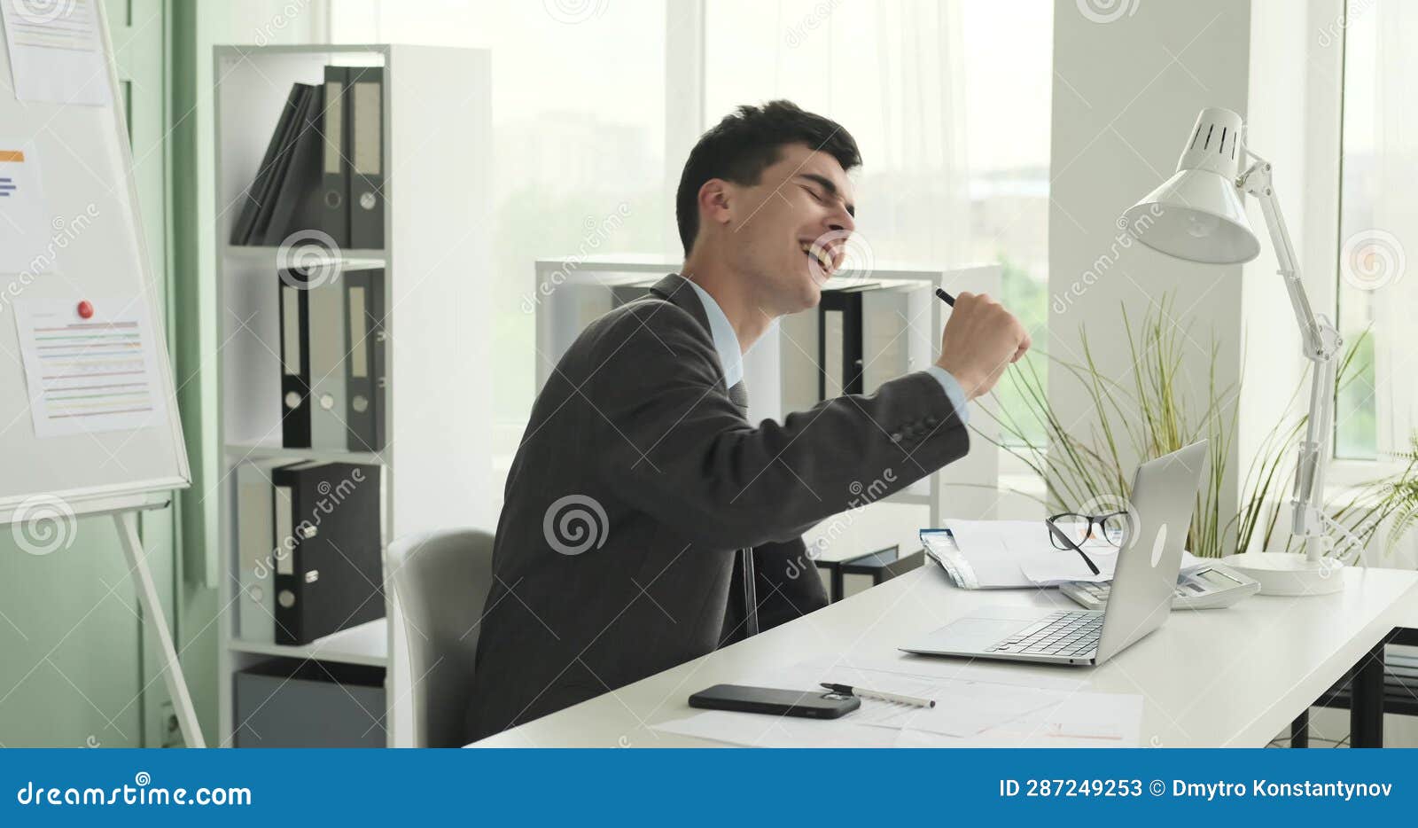 Businessman Singing at Work with a Pen As a Microphone Stock Video ...