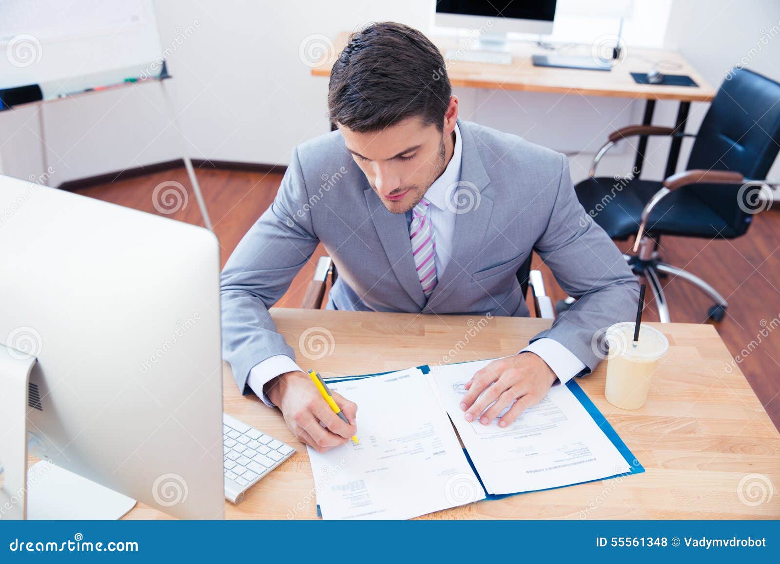 Businessman Signing Document in Office Stock Photo - Image of ...