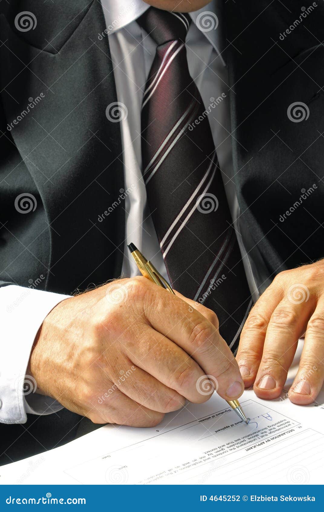 Businessman signing a form stock photo. Image of filling - 4645252