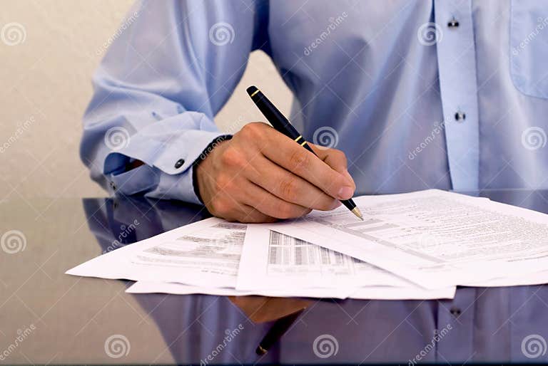 Businessman signing papers stock photo. Image of language - 2470082