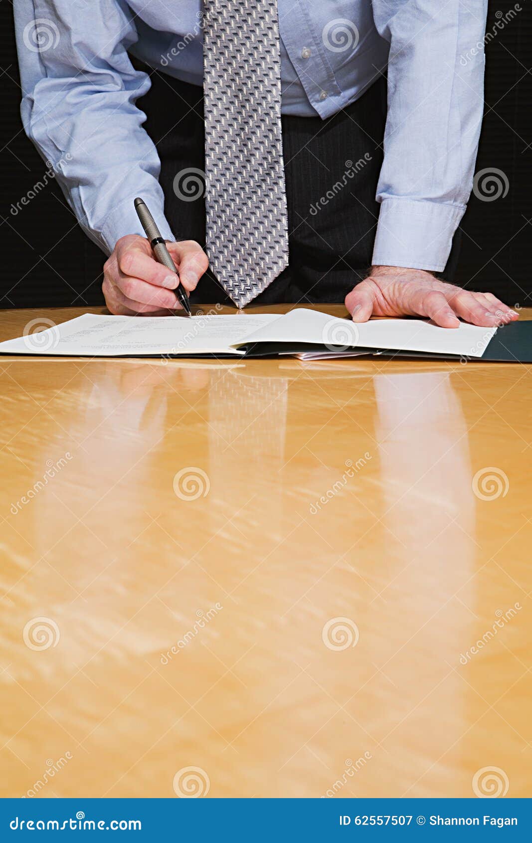Businessman Signing Paperwork Stock Image - Image of charge, caucasian ...