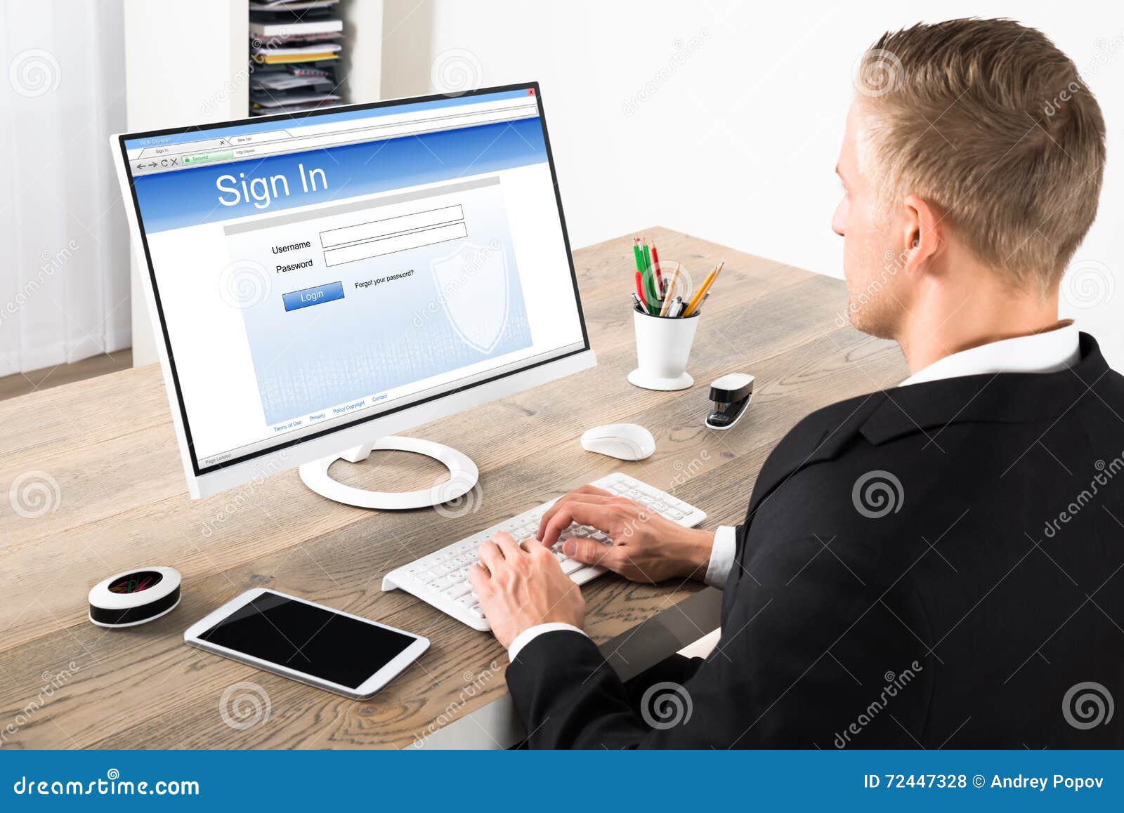 Businessman Signing into a Website on Computer Stock Photo - Image of ...