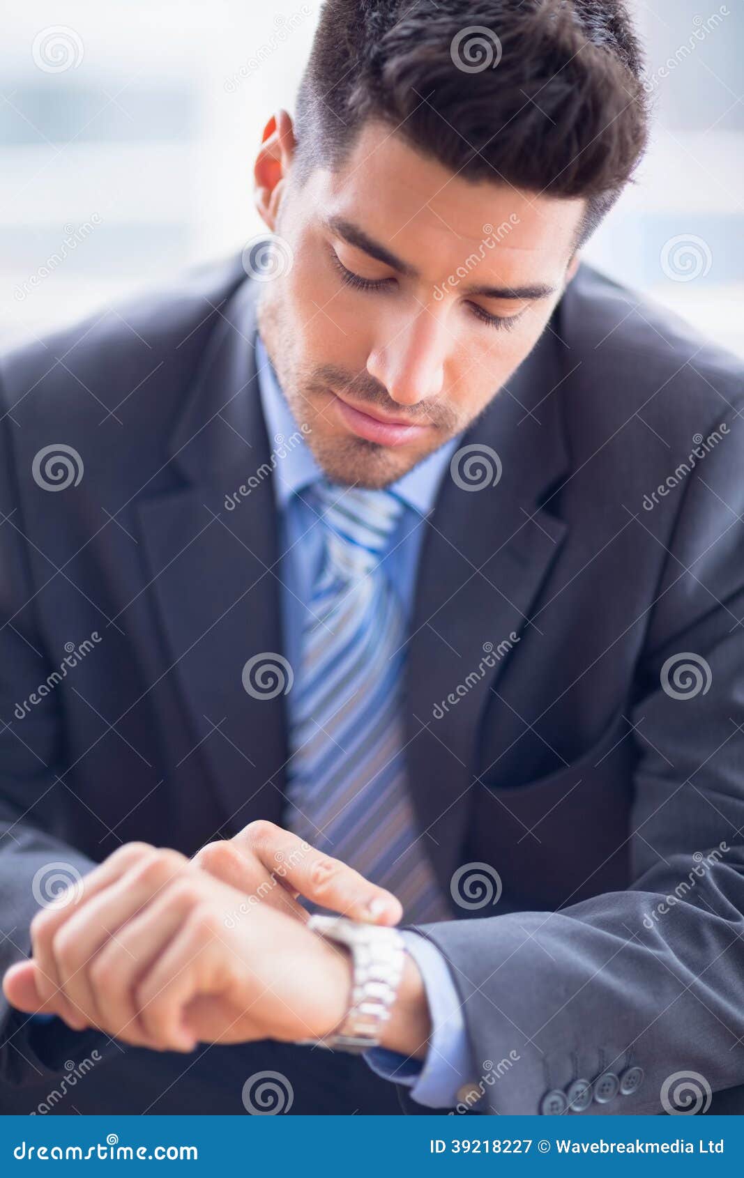Businessman Sitting Checking His Watch Stock Image - Image of sofa ...