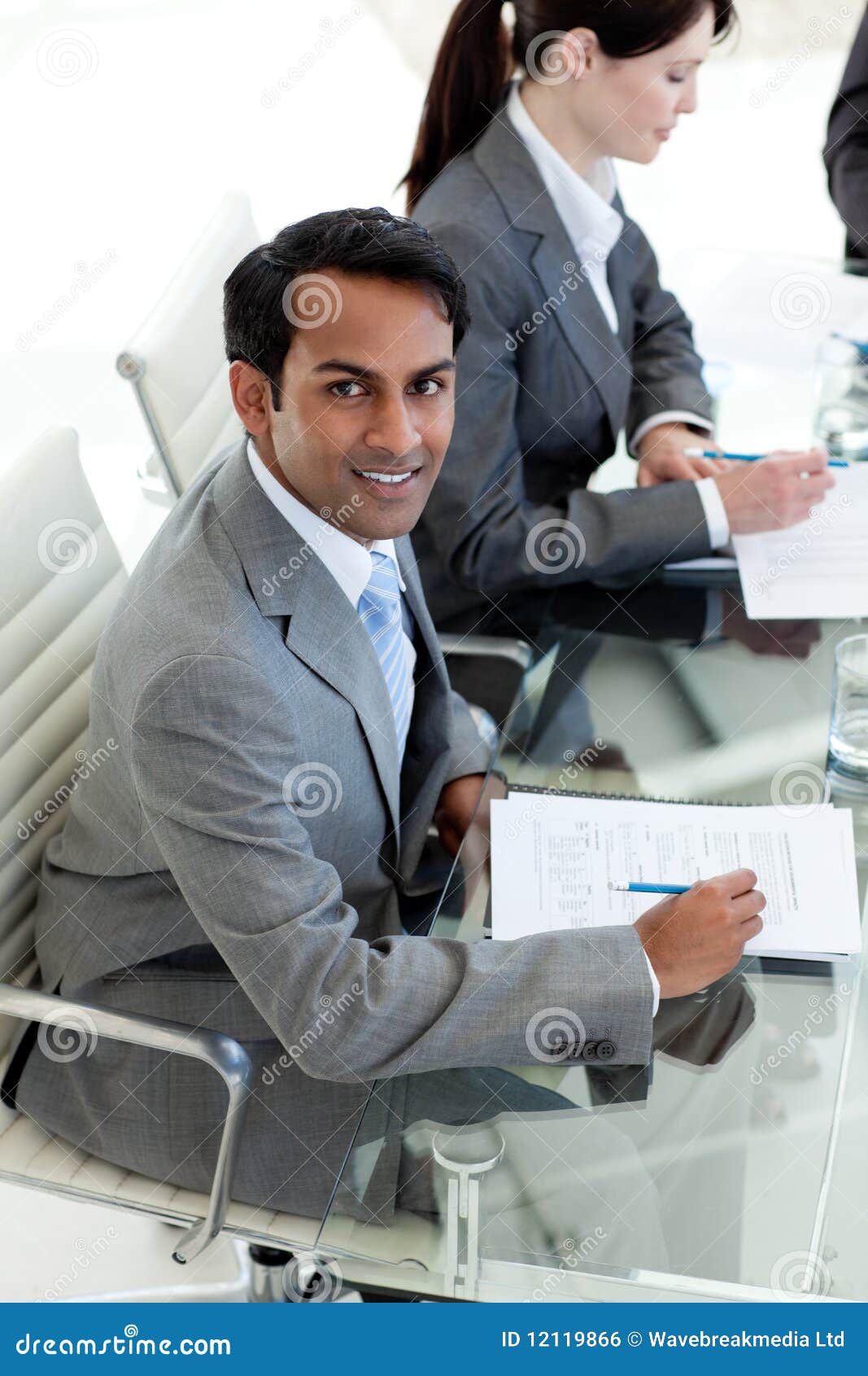 Businessman Sitting at a Conference Table Stock Photo - Image of ...