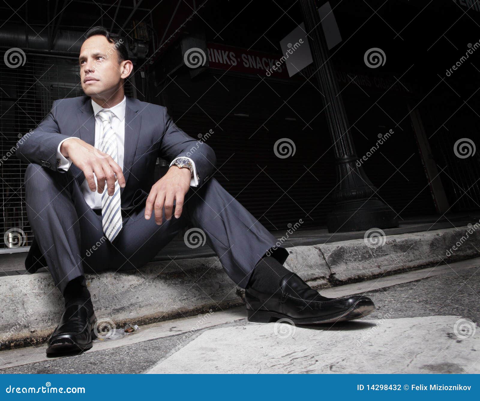Businessman Sitting on the Curb Stock Photo - Image of person, suit ...