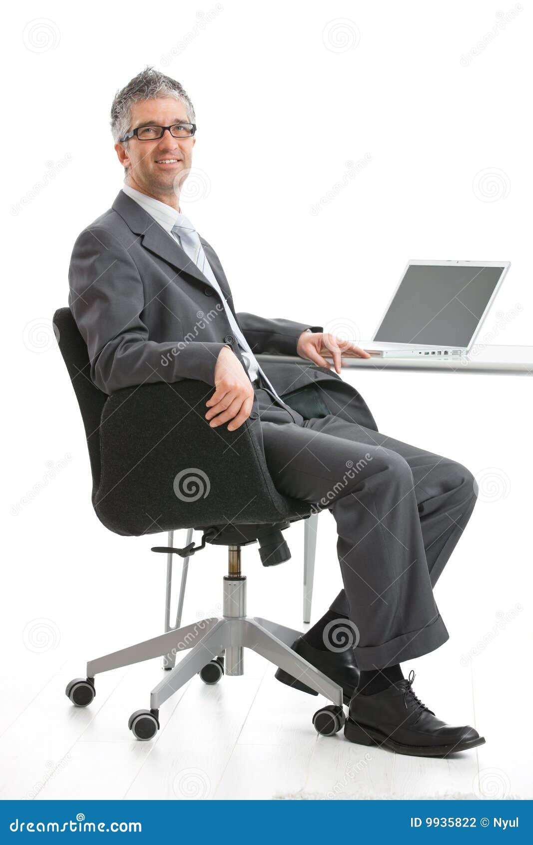 Businessman Sitting at Desk Stock Photo - Image of laptop, handsome ...