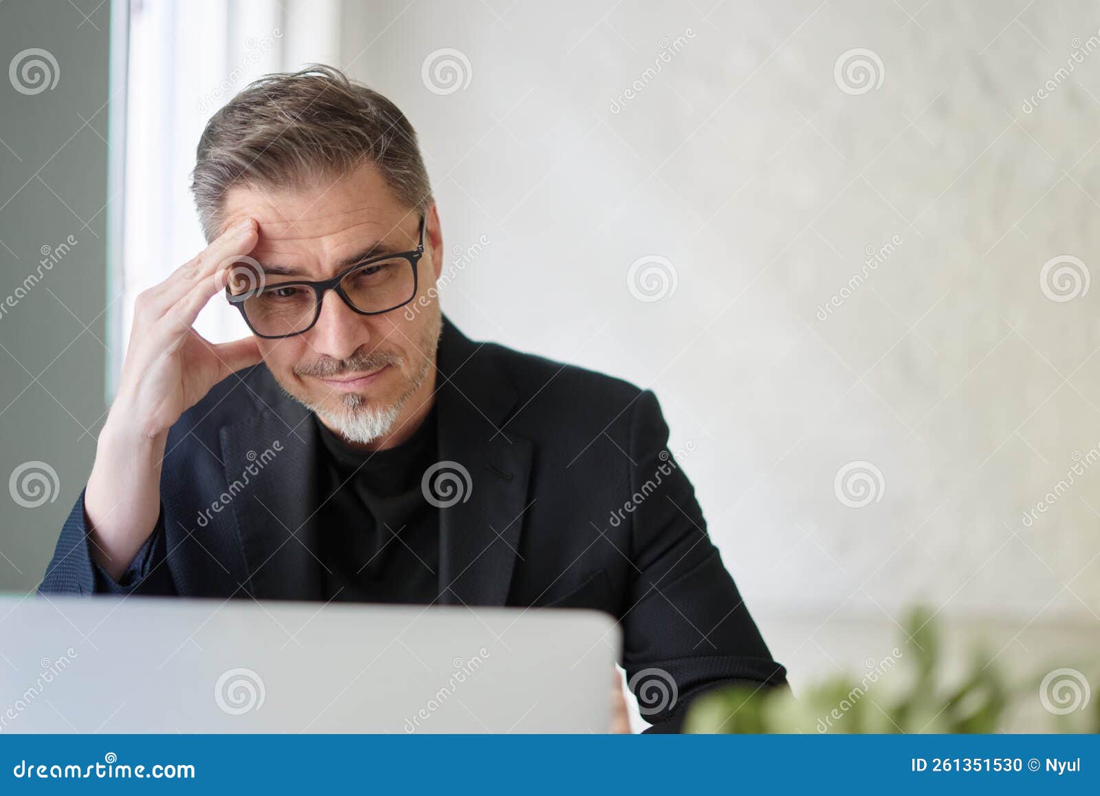 Businessman Sitting at Desk in Office Having Problem Stock Photo ...