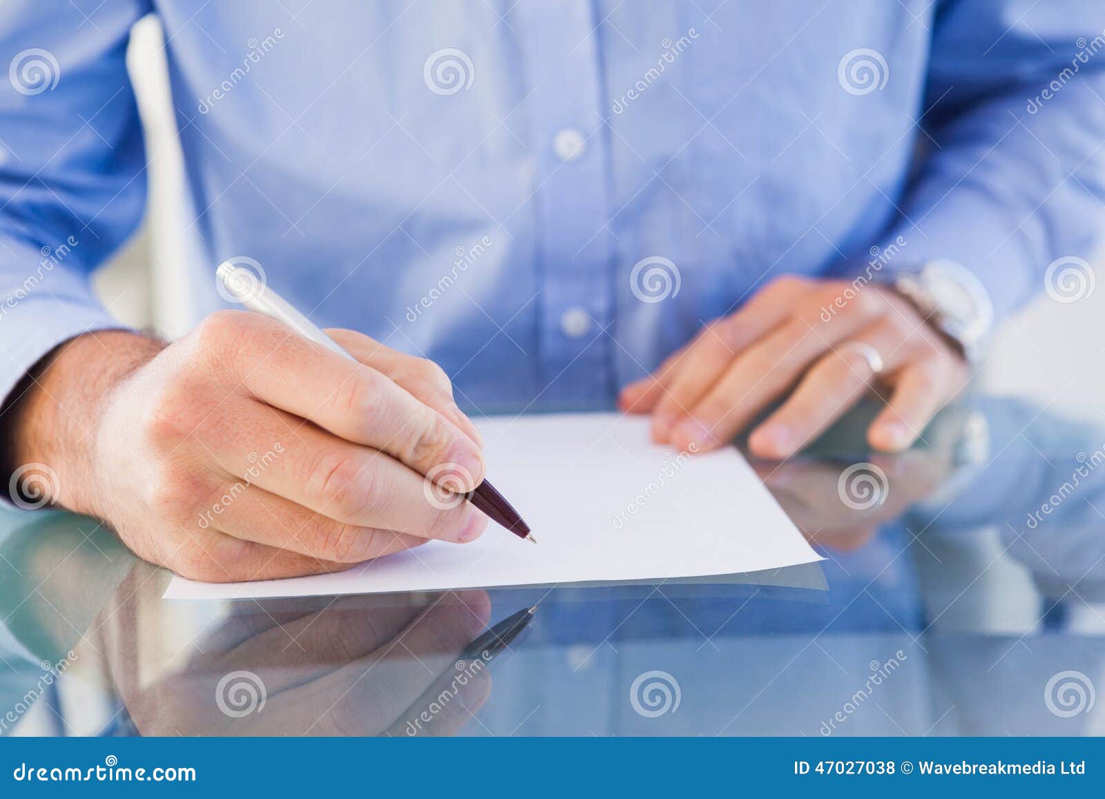 Businessman Sitting at Desk Writing Stock Photo - Image of career ...