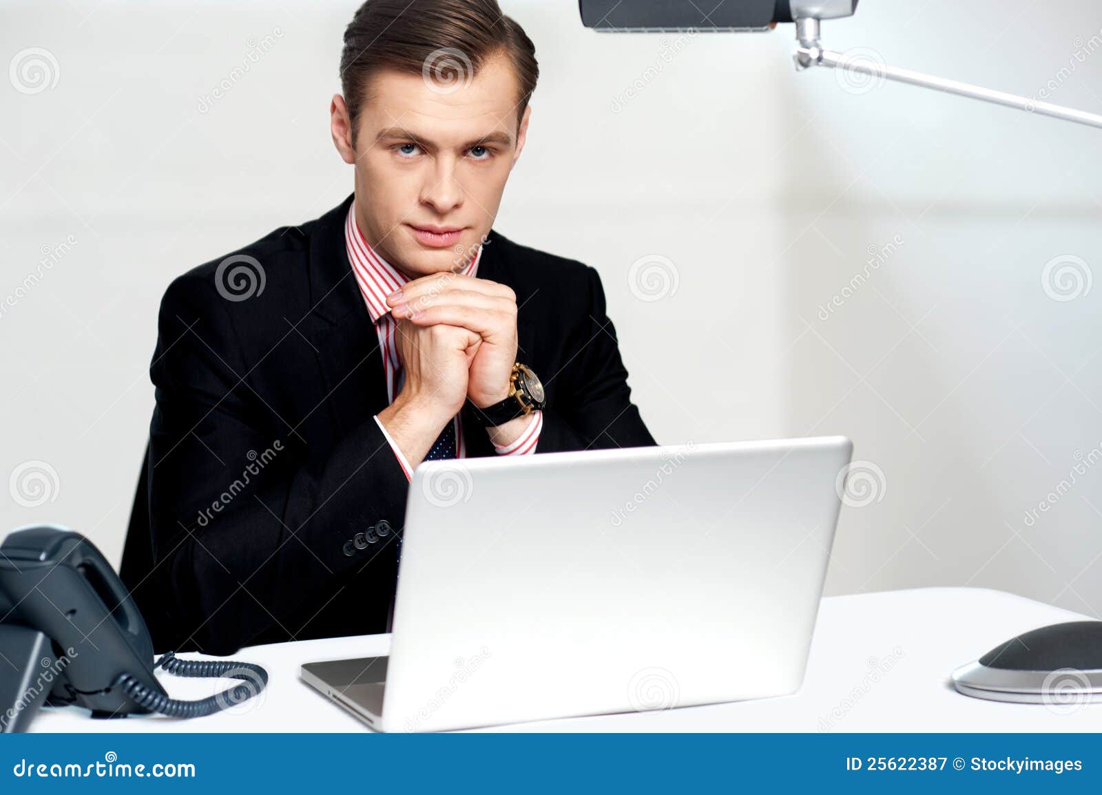 Businessman Sitting in Front of Laptop Stock Image - Image of digital ...