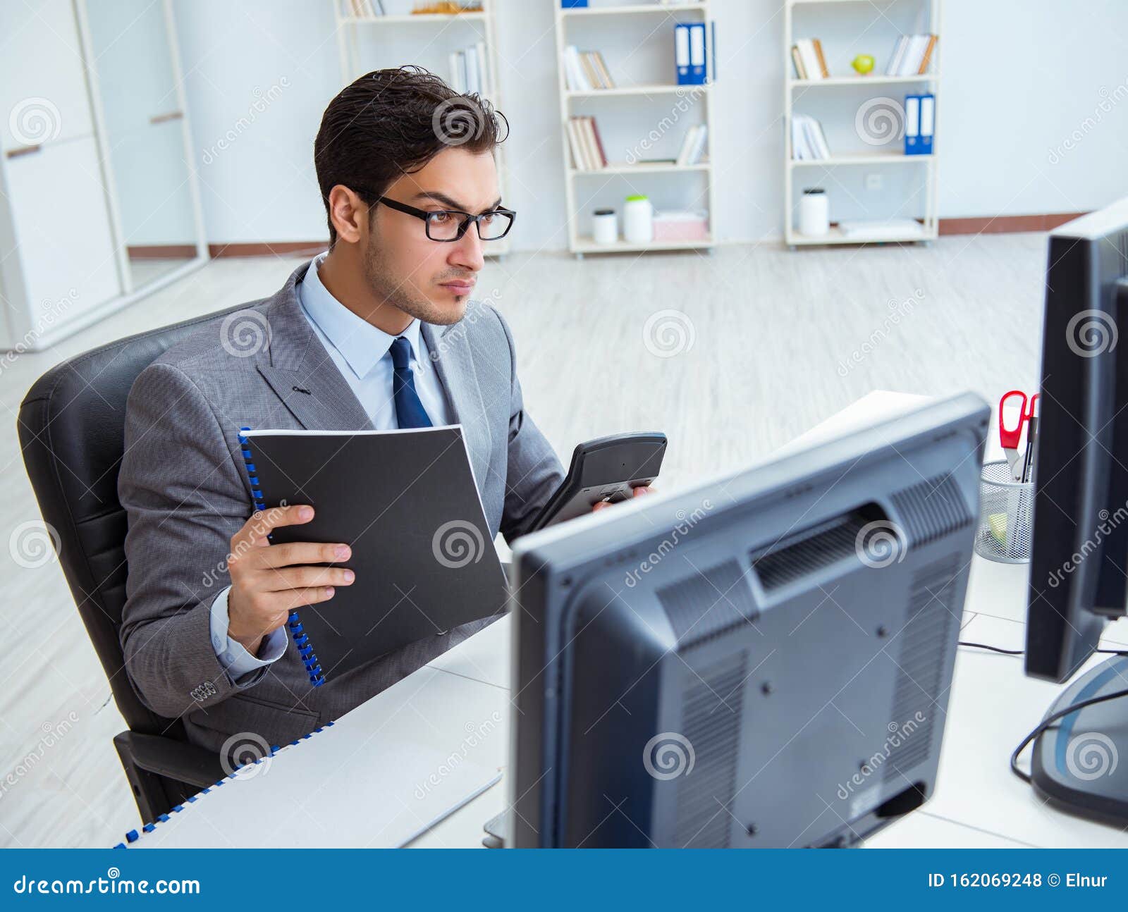 Businessman Sitting in Front of Many Screens Stock Photo - Image of ... Businessman Sitting in Front of Many Screens Stock Photo - Image of ...