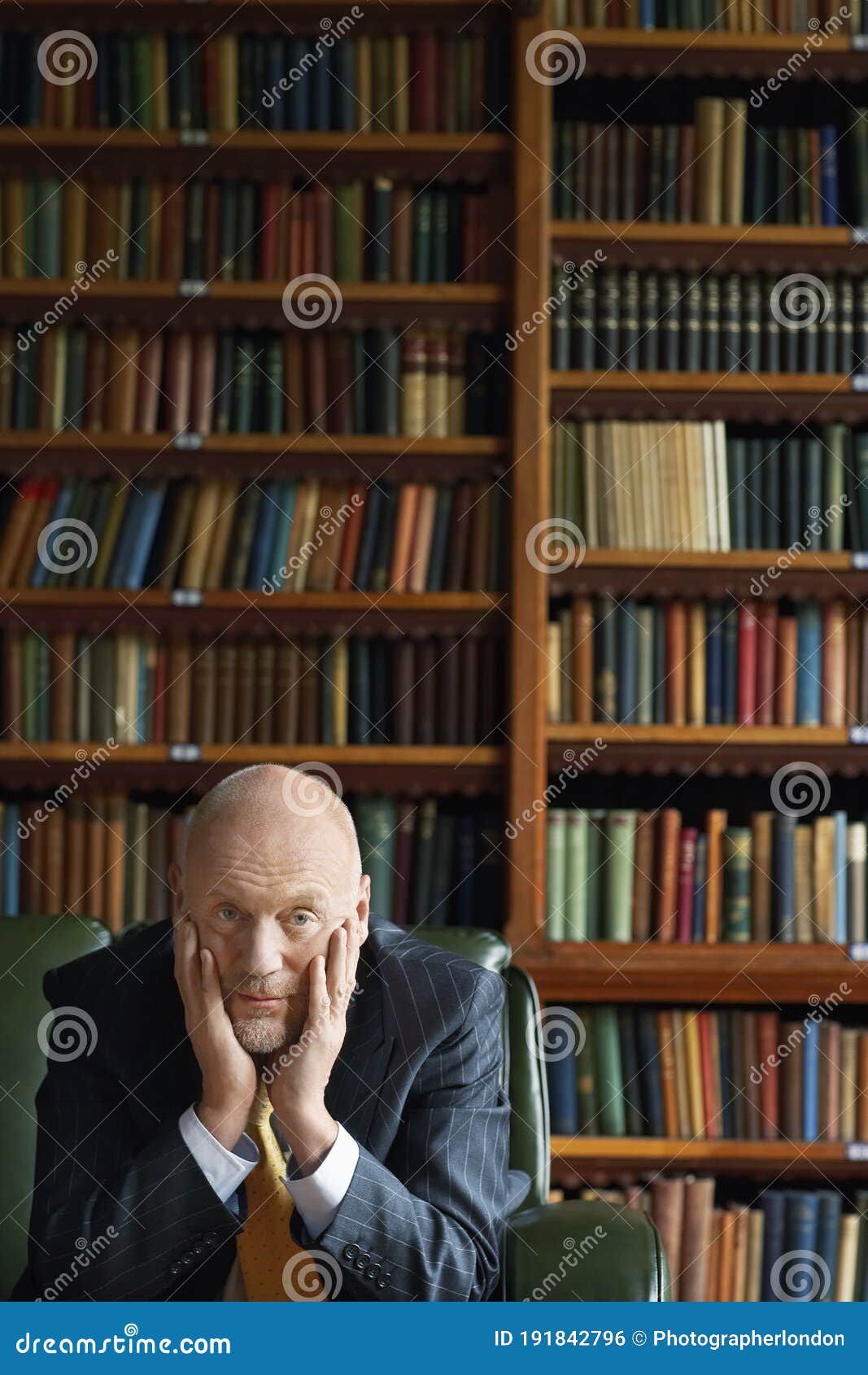Portrait of Senior Businessman Sitting in Library Stock Photo - Image ...